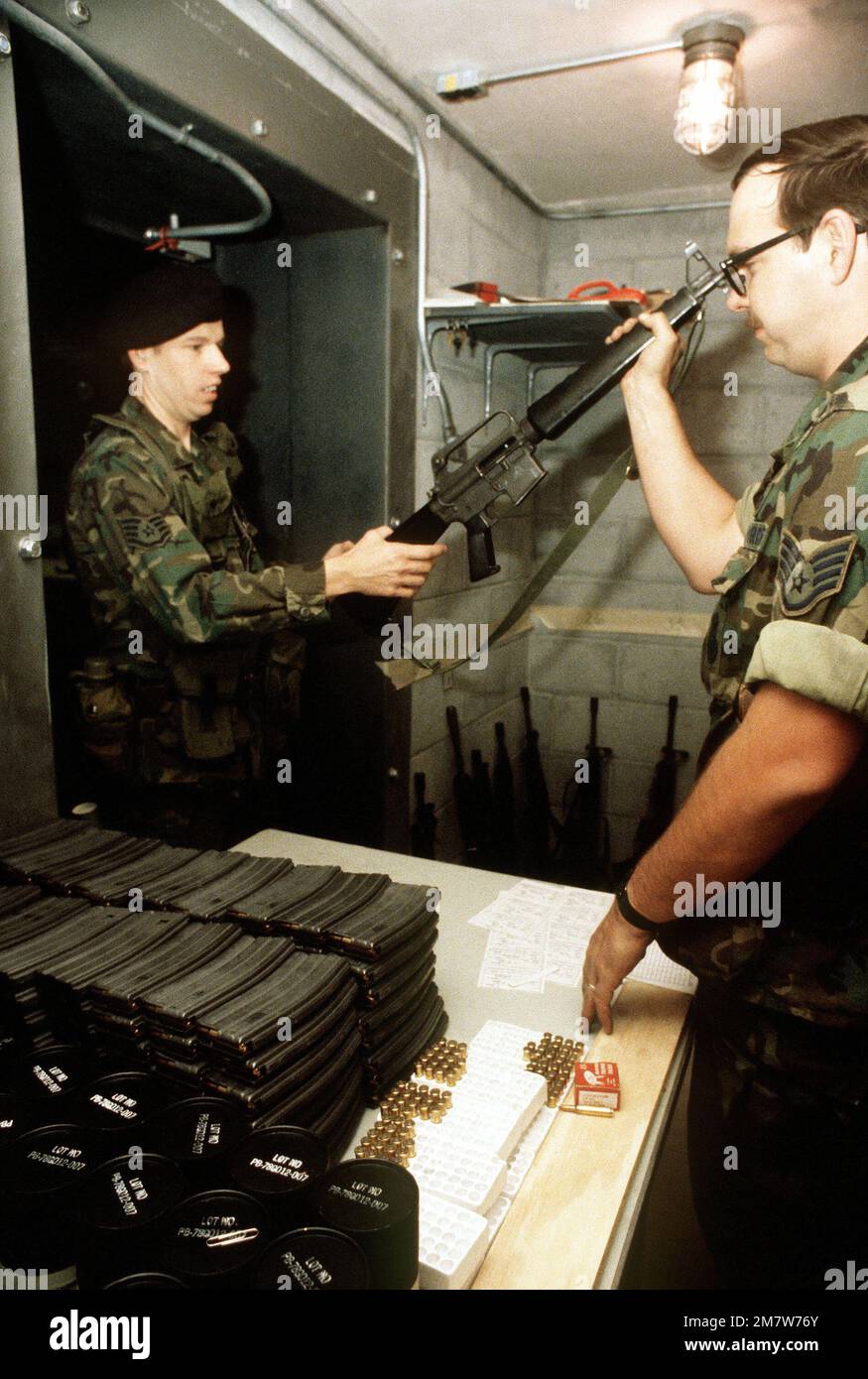 A member of the 91st Security Police Squadron is issued an M-16A1 rifle ...
