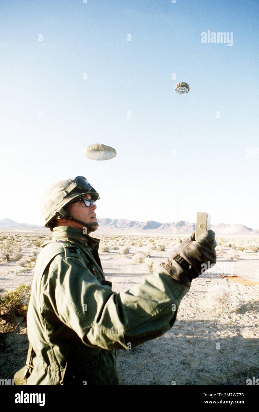 CPT Jim Danley of the 82nd Airborne Division checks wind reading at the Rock Drop Zone during ...