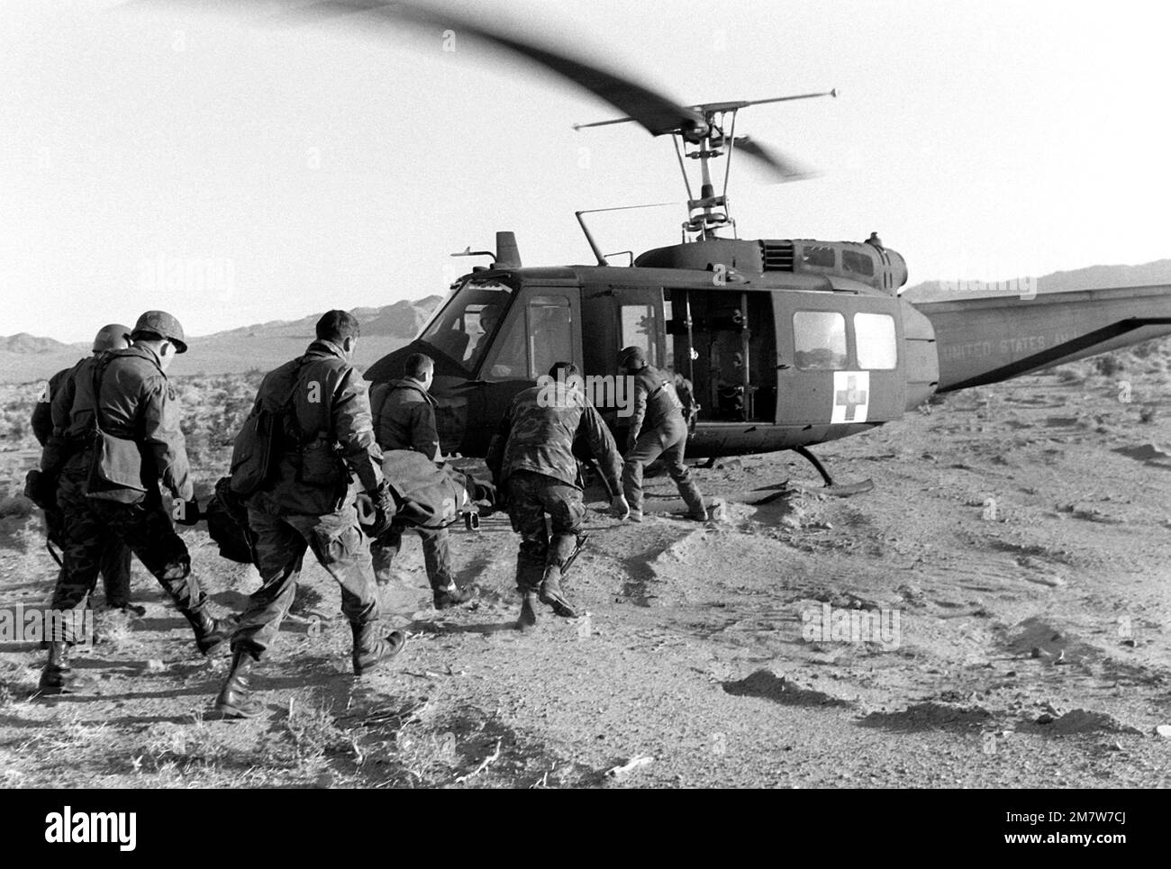 Members of the 82nd Airborne Division carry a fellow paratrooper to a ...