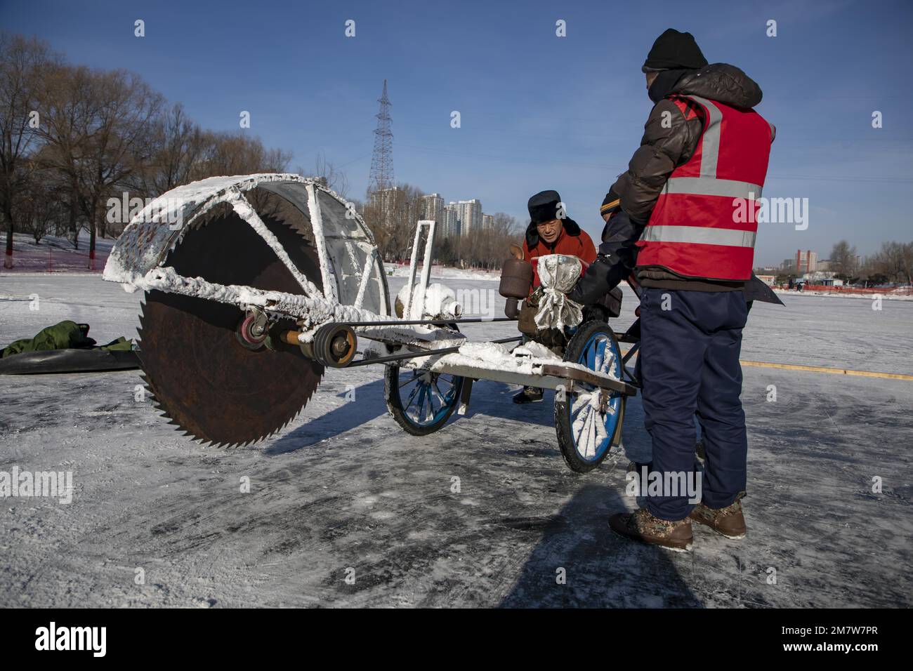 Workers collect ice blocks in Jiangbin Park to build an ice and snow ...