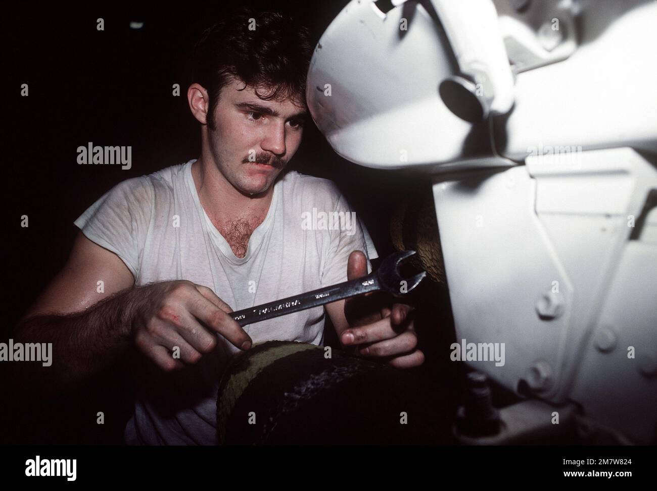 AIRMAN Apprentice (AA) Steve R. McClure mounts a Mark 82 bomb onto an A ...