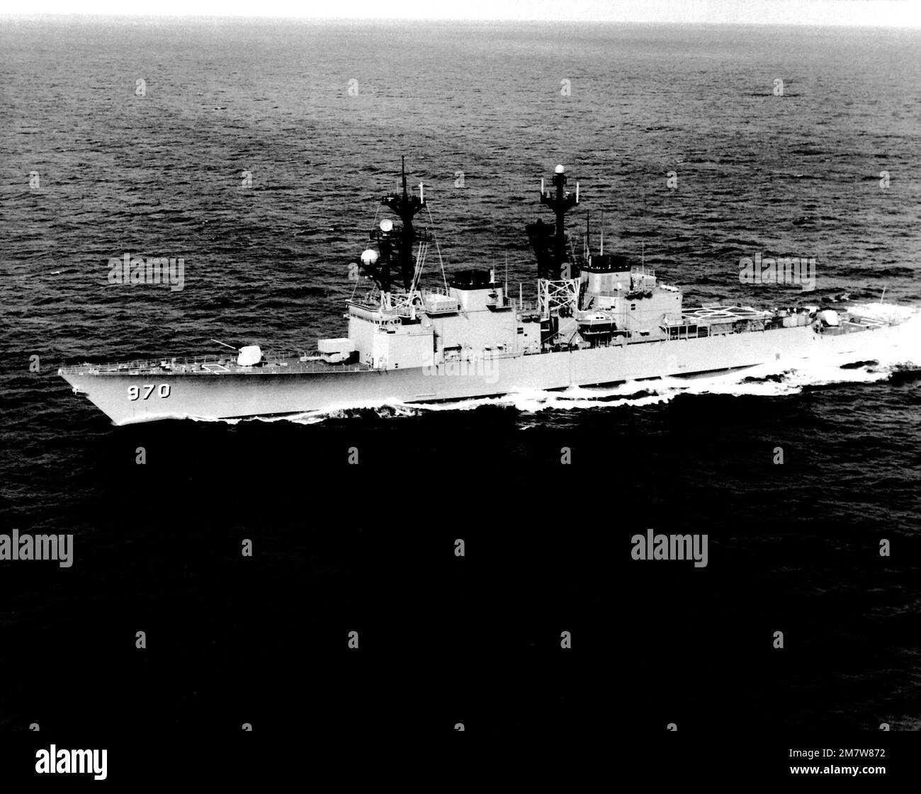 Aerial port bow view of the destroyer USS CARON (DD-970) underway ...