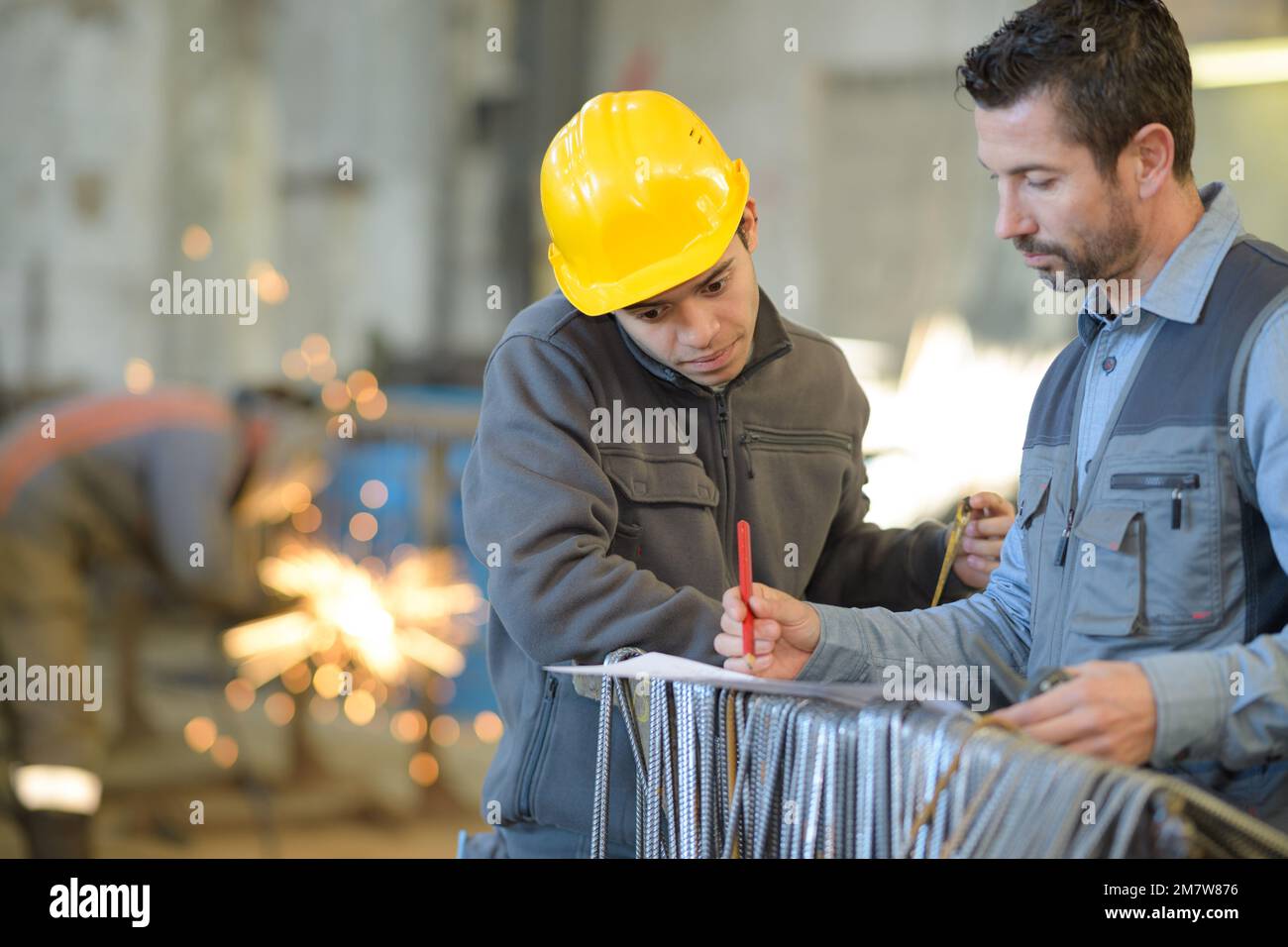 Supervisor talking in steel factory hi-res stock photography and images ...
