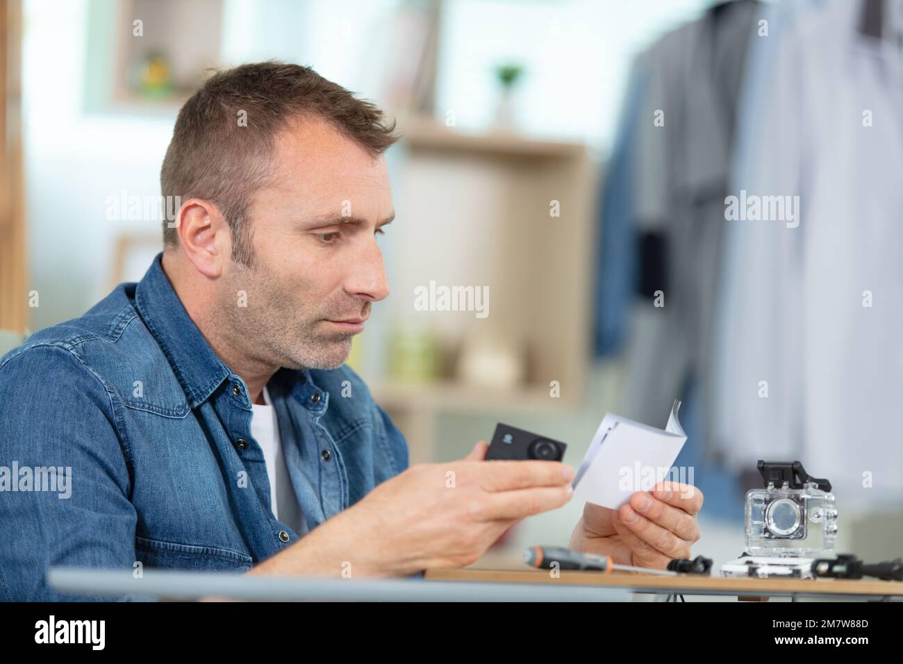 a man is fixing camera Stock Photo - Alamy