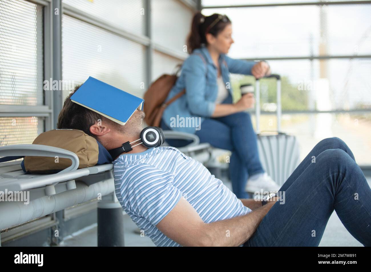 a student is resting on bench Stock Photo - Alamy