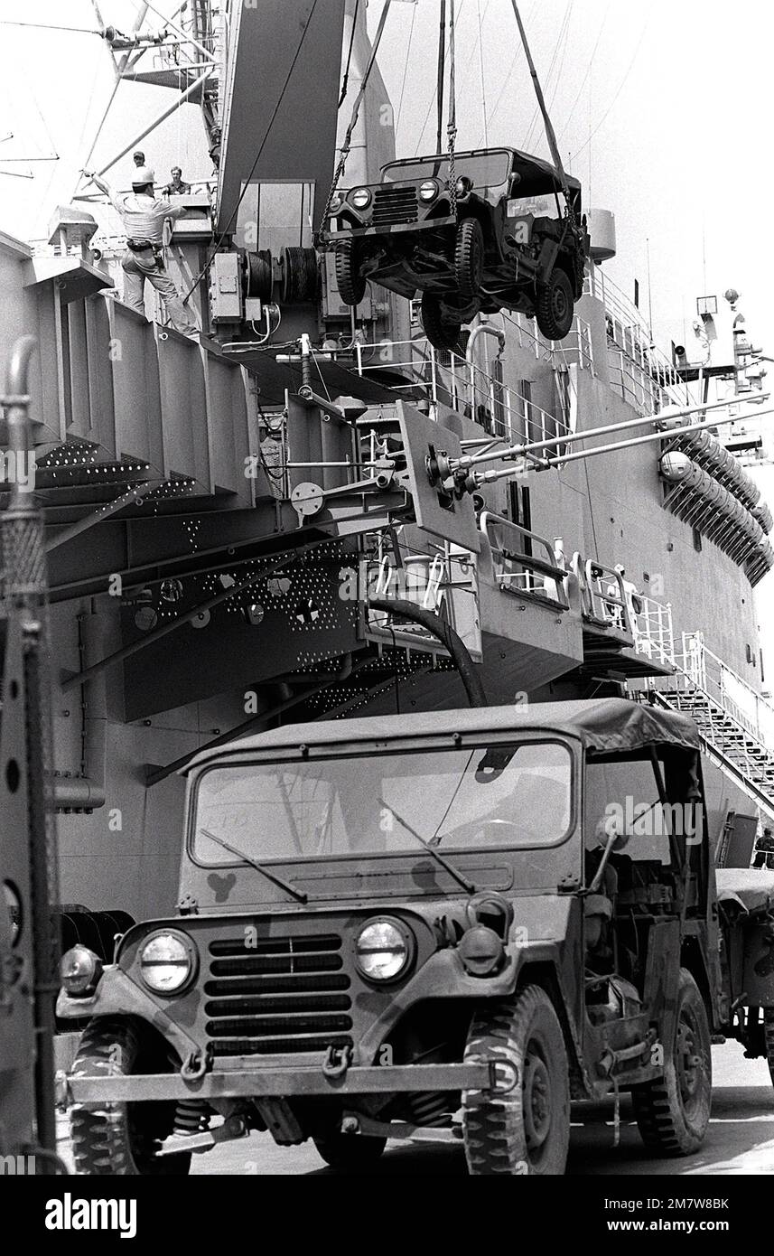 Jeeps are loaded aboard the amphibious transport dock USS DUBUQUE (LPD ...