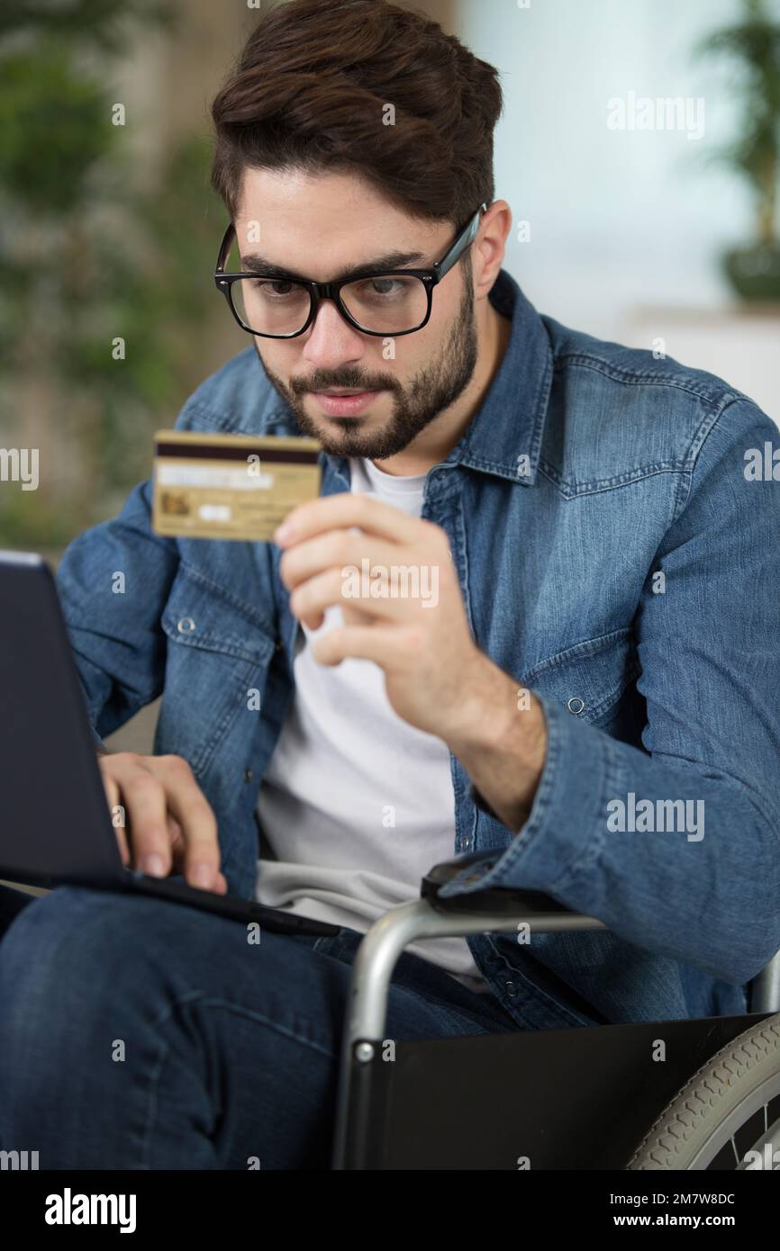Disabled man operating wheelchair hi-res stock photography and images ...