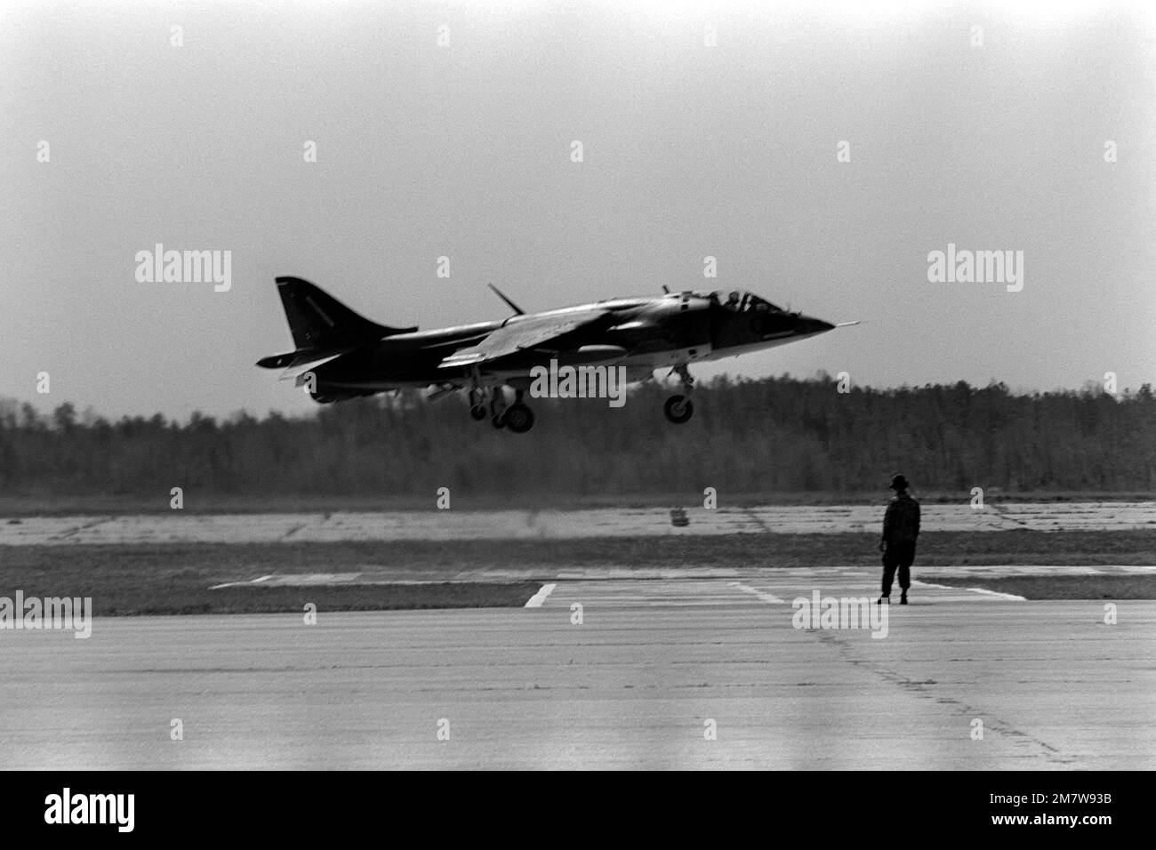 A Marine AV-8A Harrier aircraft lands at Blackstone Airfield to take ...