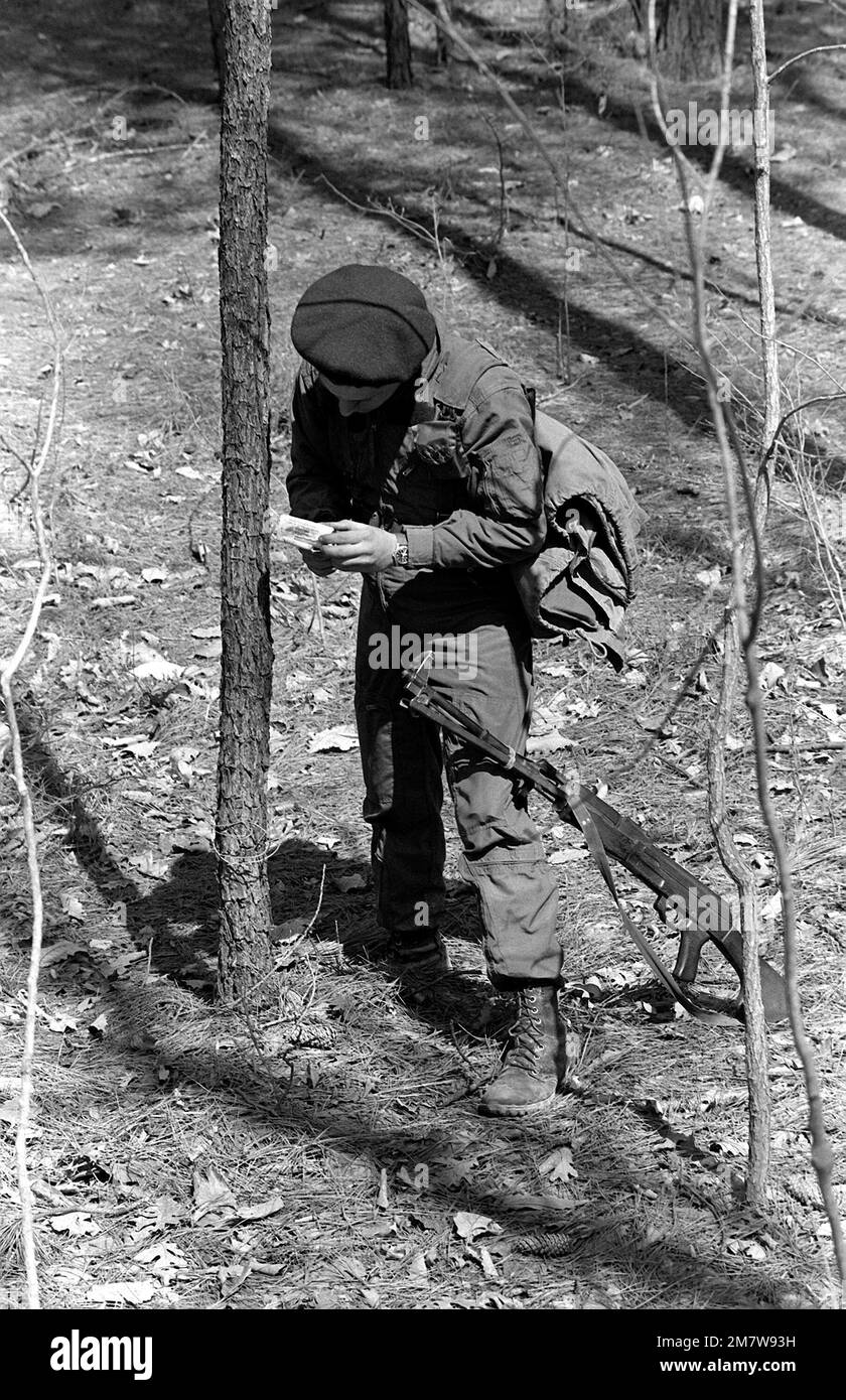 A U.S. Marine from the 6th Marine Amphibious Brigade, sets a booby trap ...