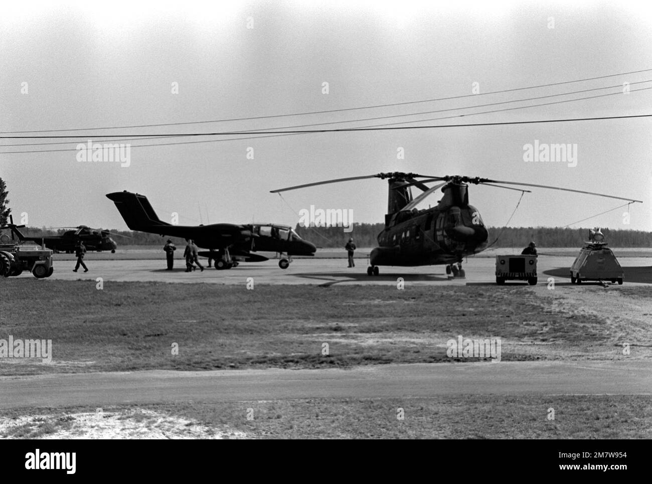 A Marine OV-10A Bronco aircraft and a CH-46 Sea Knight helicopter are ...