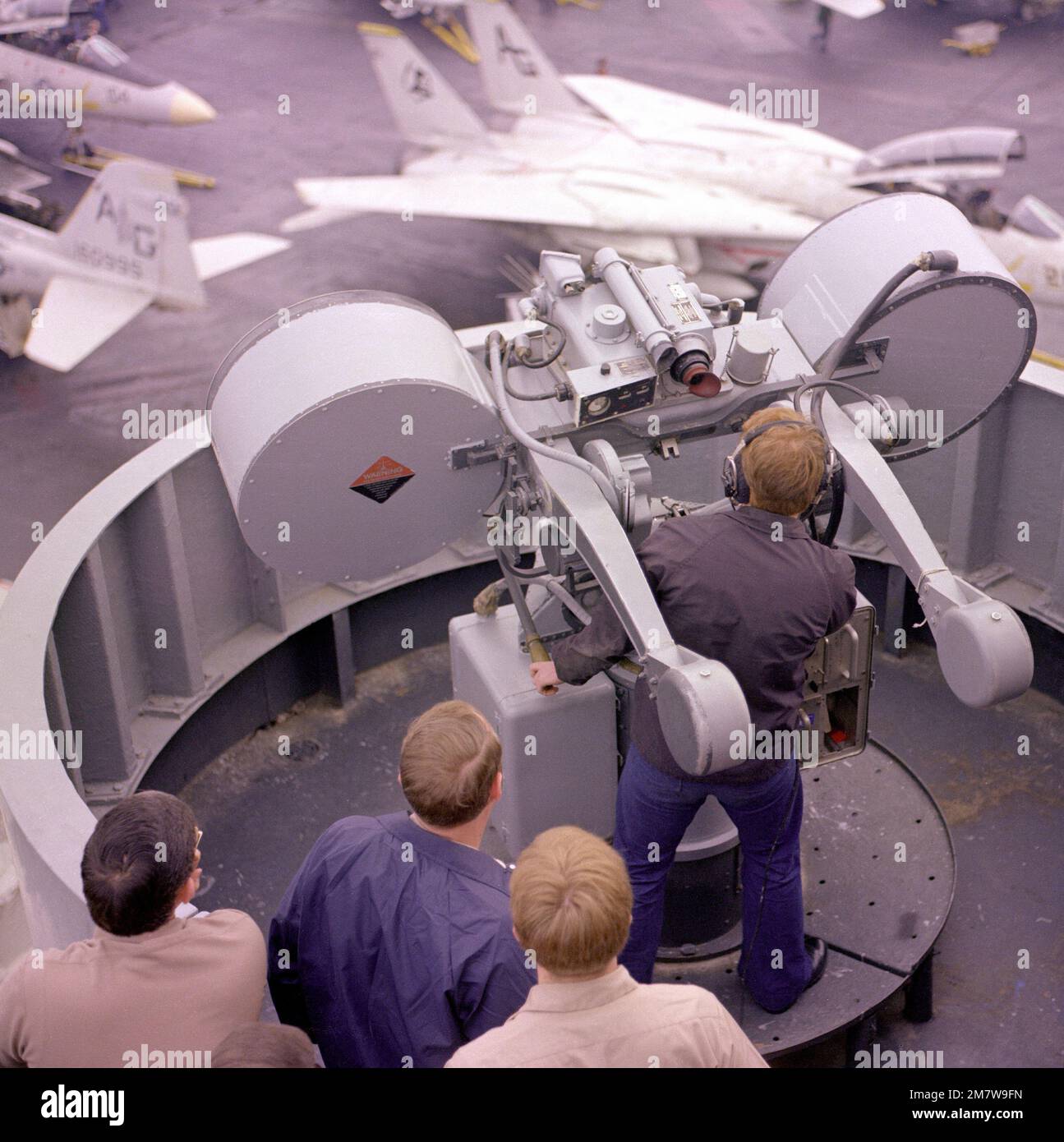 A gunner's mate mans the Mark 115 Sea Sparrow fire control system director during a RIM-7 Sea ...