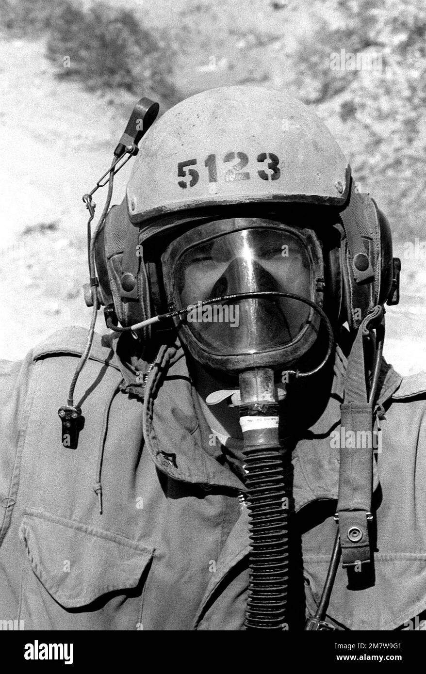 Close-up view of an AMTRAC (LVTP-7) gunner wearing his helmet and gas ...
