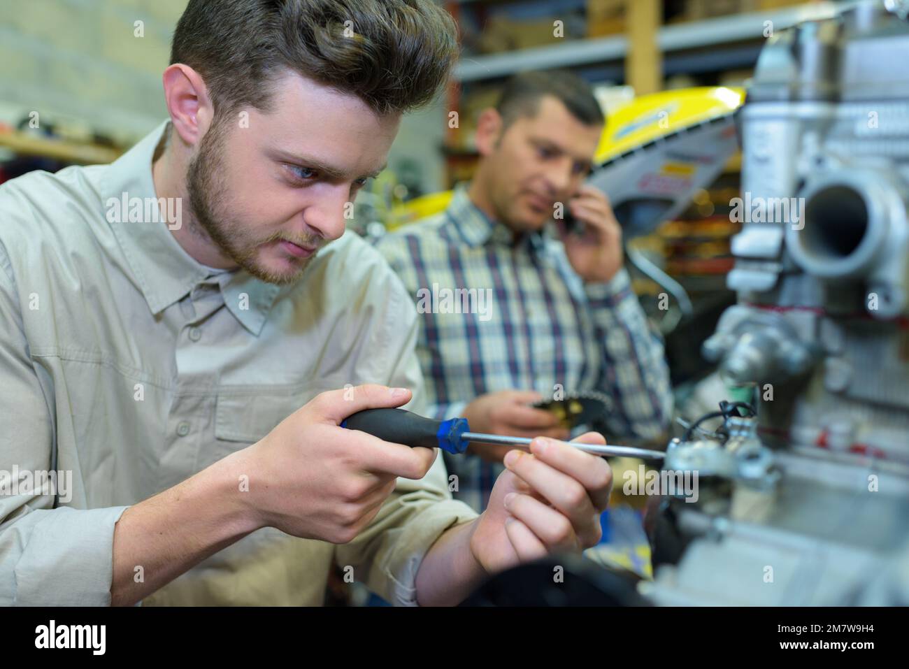 worker twists the screw with a screwdriver Stock Photo - Alamy
