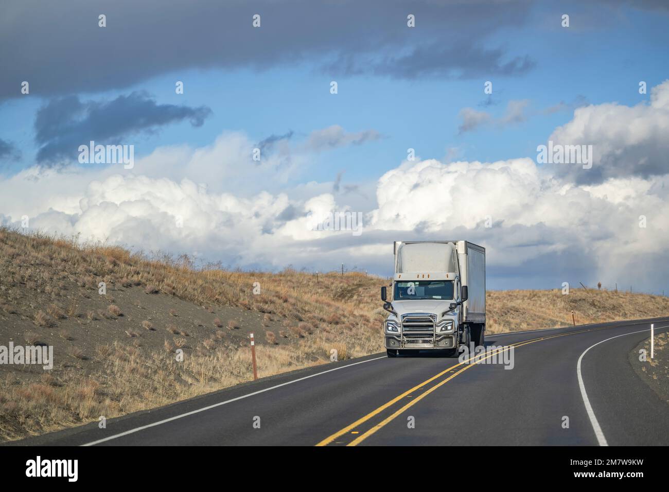 Industrial big rig white semi truck tractor with roof spoiler and ...