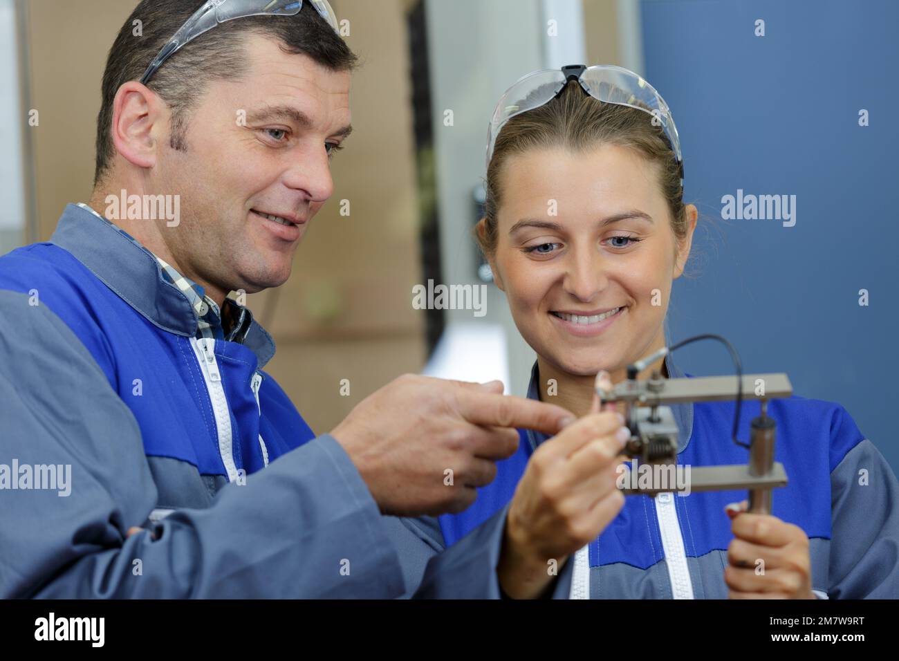 male and female engineers looking at sensor Stock Photo - Alamy