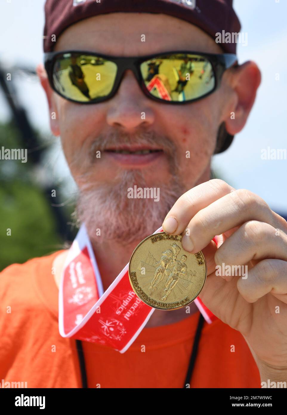 Kevin Boatwright, Area 8 athlete, displays his gold medal during the ...
