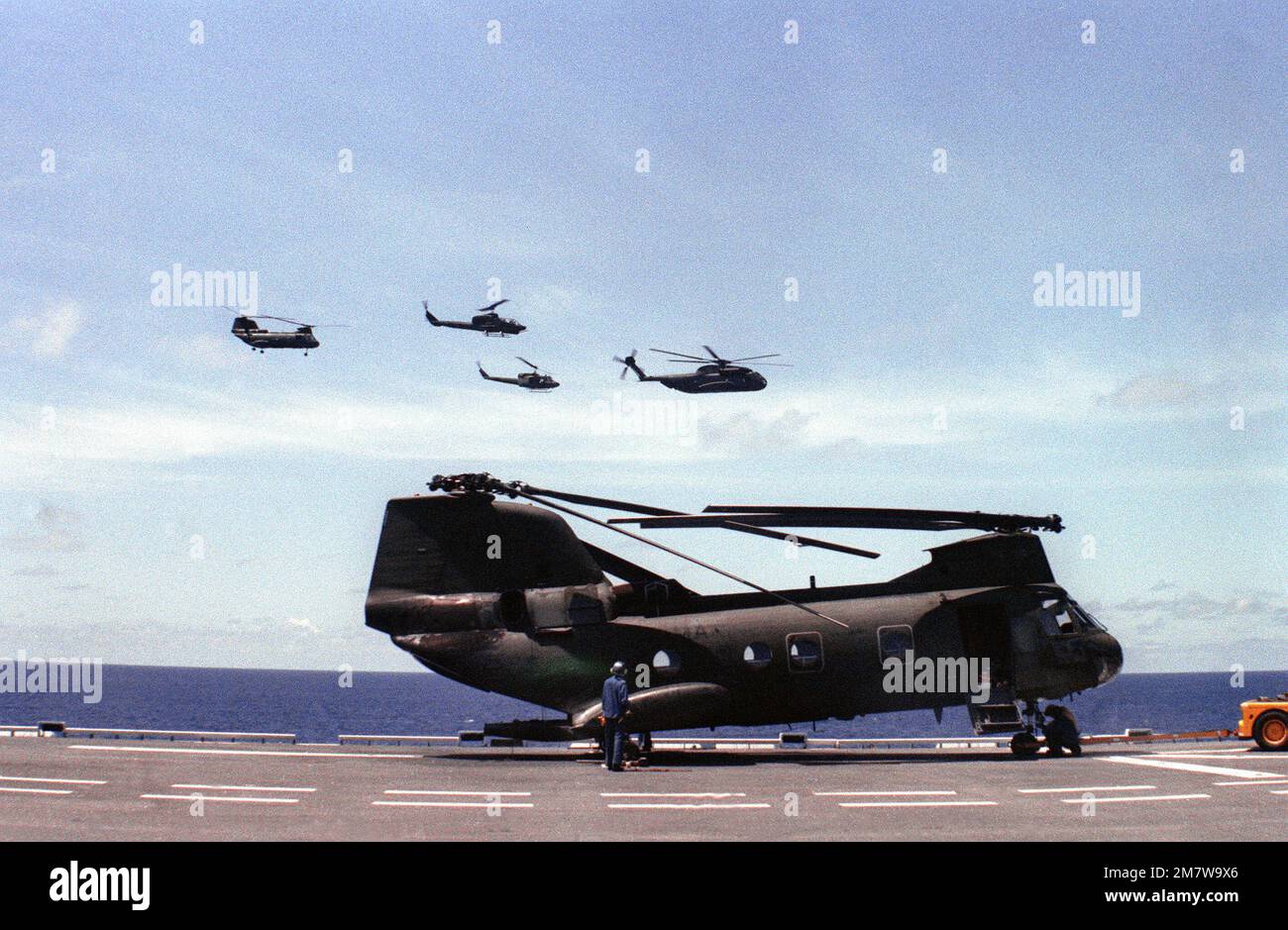 Four Marine helicopters from Composite Squadron 165 (VC-165) fly past ...