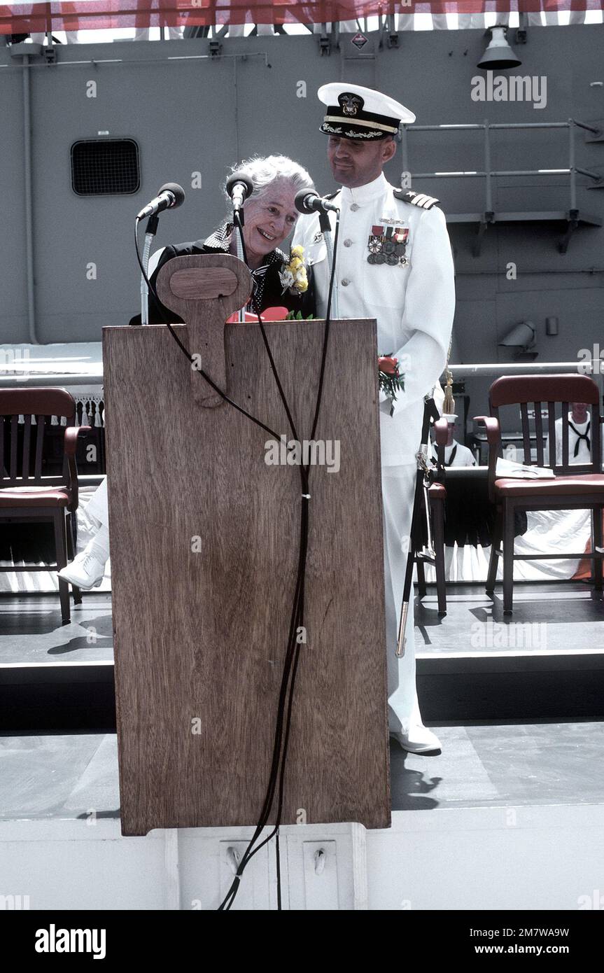 Mrs. Lewis B. Puller, ship's sponsor, and CDR Ralph K. Martin ...