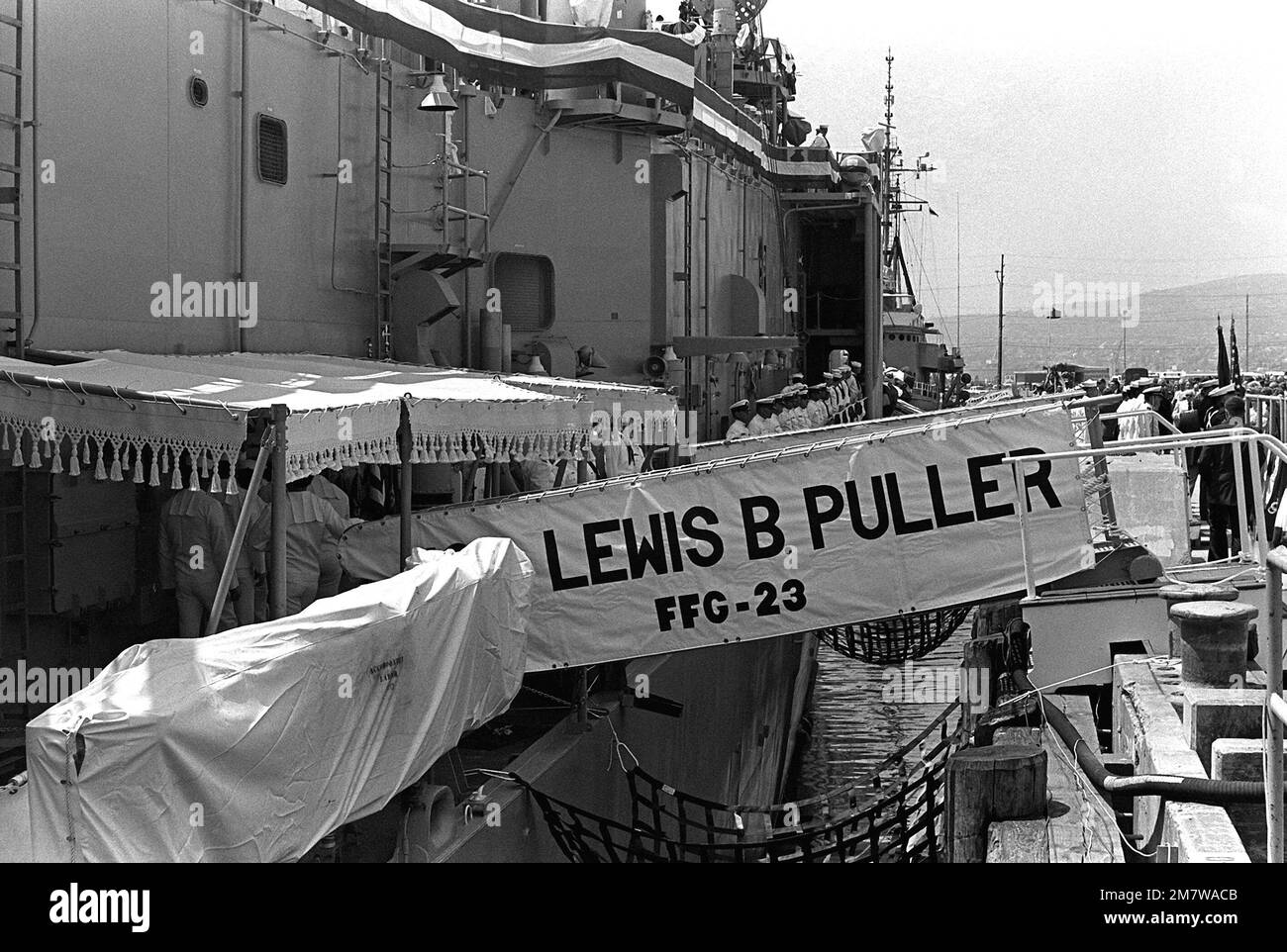 The brow banner of the guided missile frigate USS LEWIS B. PULLER (FFG ...