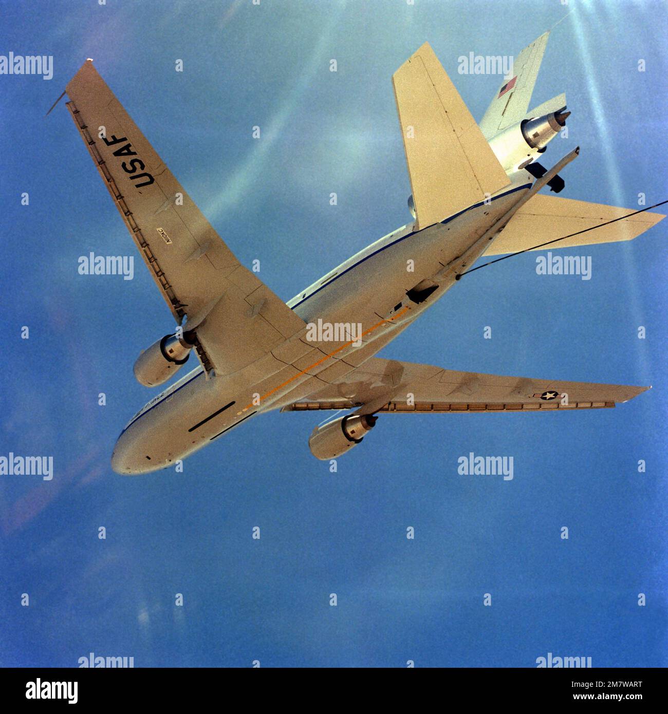 An underside view of a KC-10A Extender aircraft in flight. Base ...