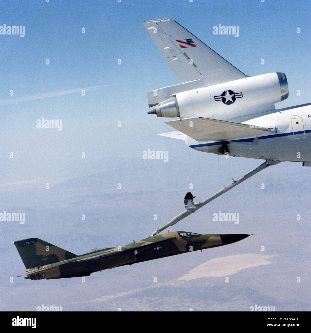 Right side view of a KC-10A Extender aircraft (tail section) refueling ...