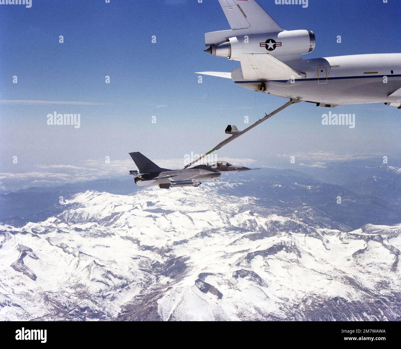 A view of a KC-10A Extender aircraft (tail section) refueling an F-16 ...