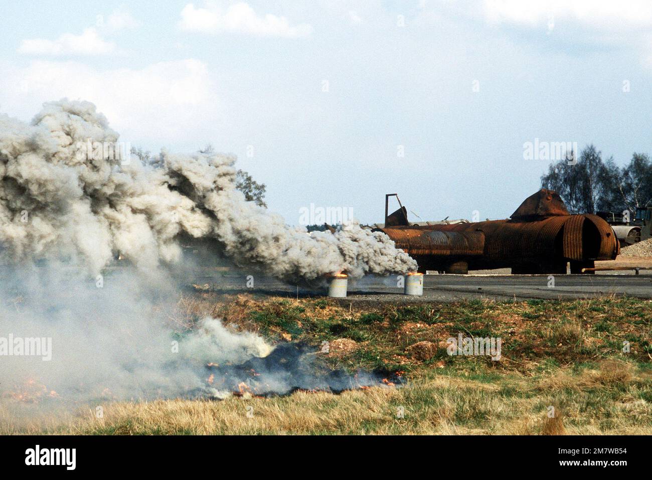 Smoke is created to simulate an aircraft fire, to test the response of ...