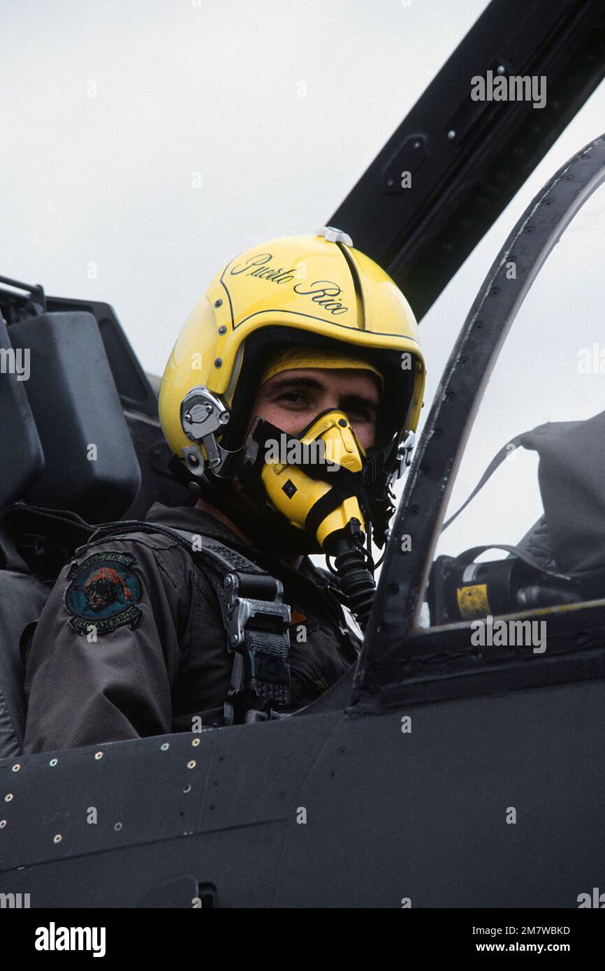A pilot aboard an A-7 Corsair II aircraft prepares for flight during ...