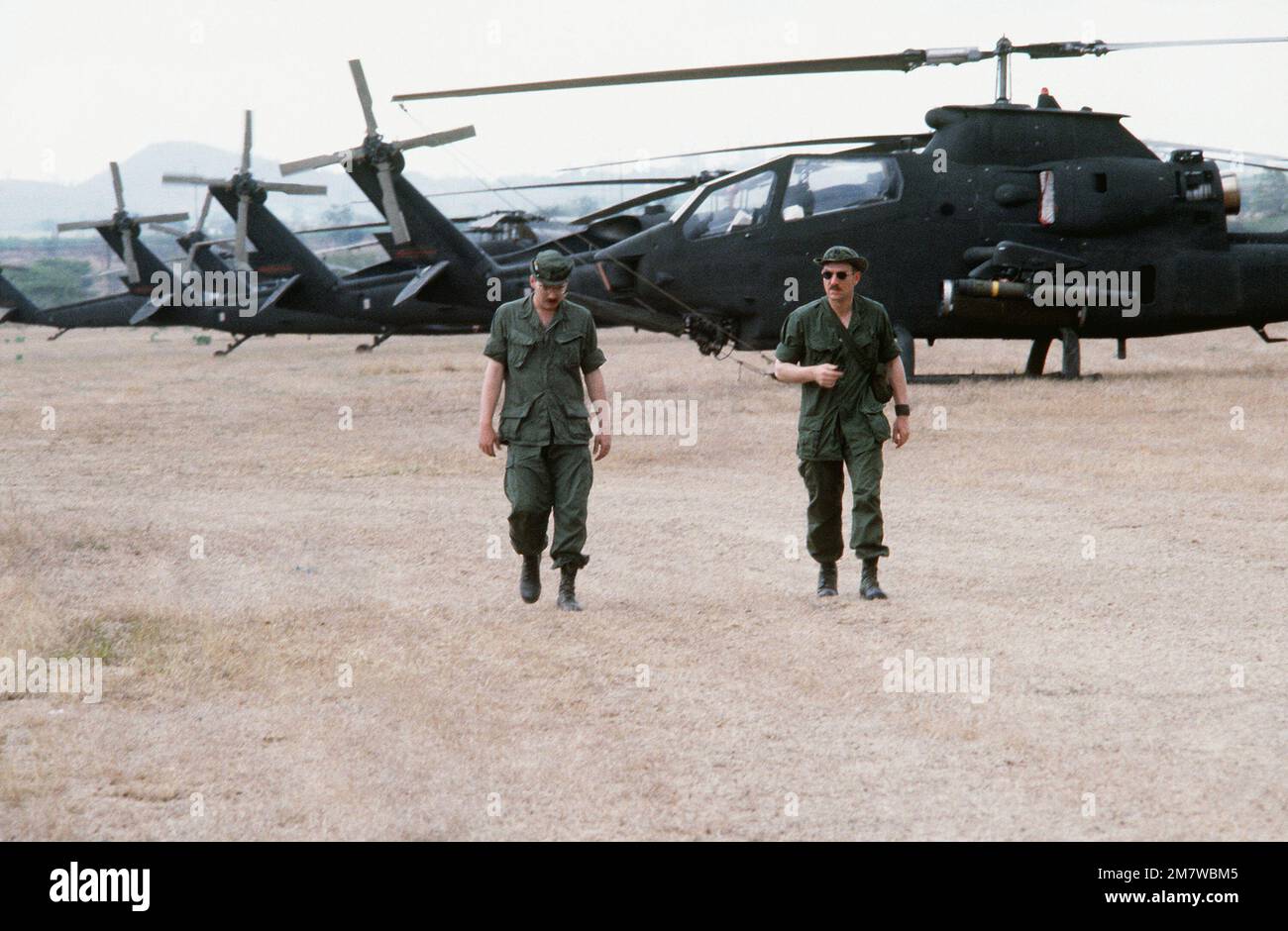 SSGT Rodney Chaplin and CPT Wallace Jenkins, left to right, walk on the ...