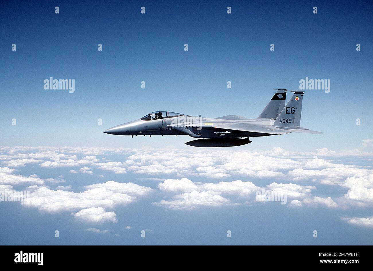 An air-to-air left side view of an F-15 Eagle aircraft from the 33rd ...