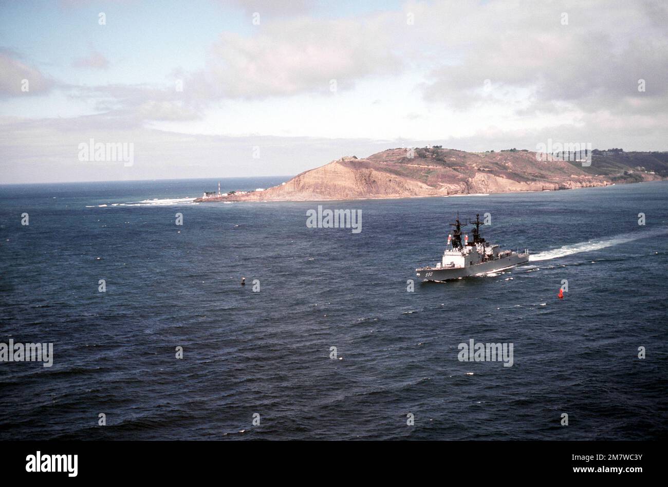 Aerial port bow view of the destroyer USS INGERSOLL (DD-990) underway ...