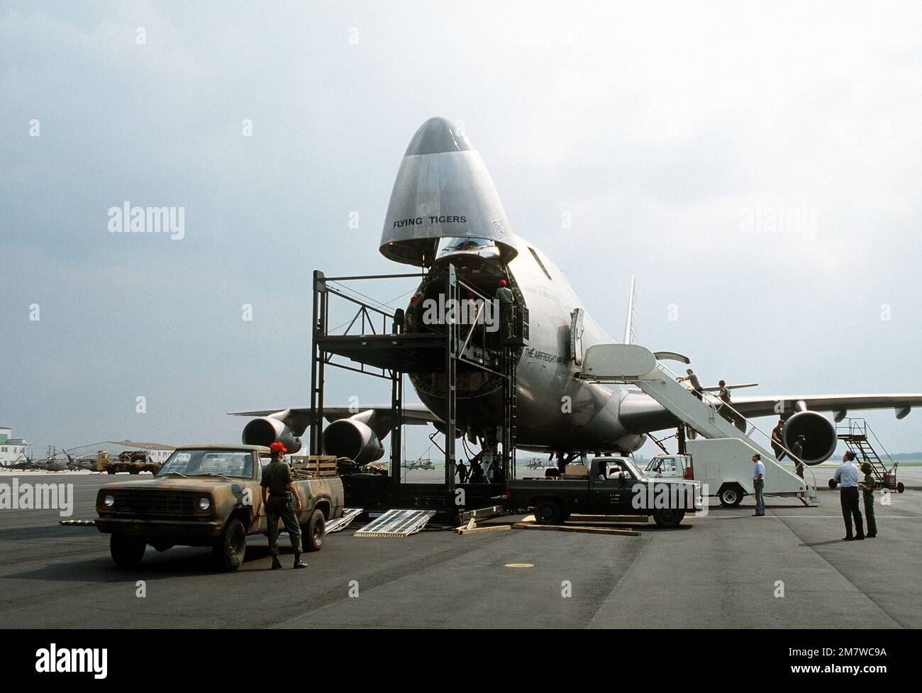 A left front view of a 747 cargo aircraft being prepared for uploading ...