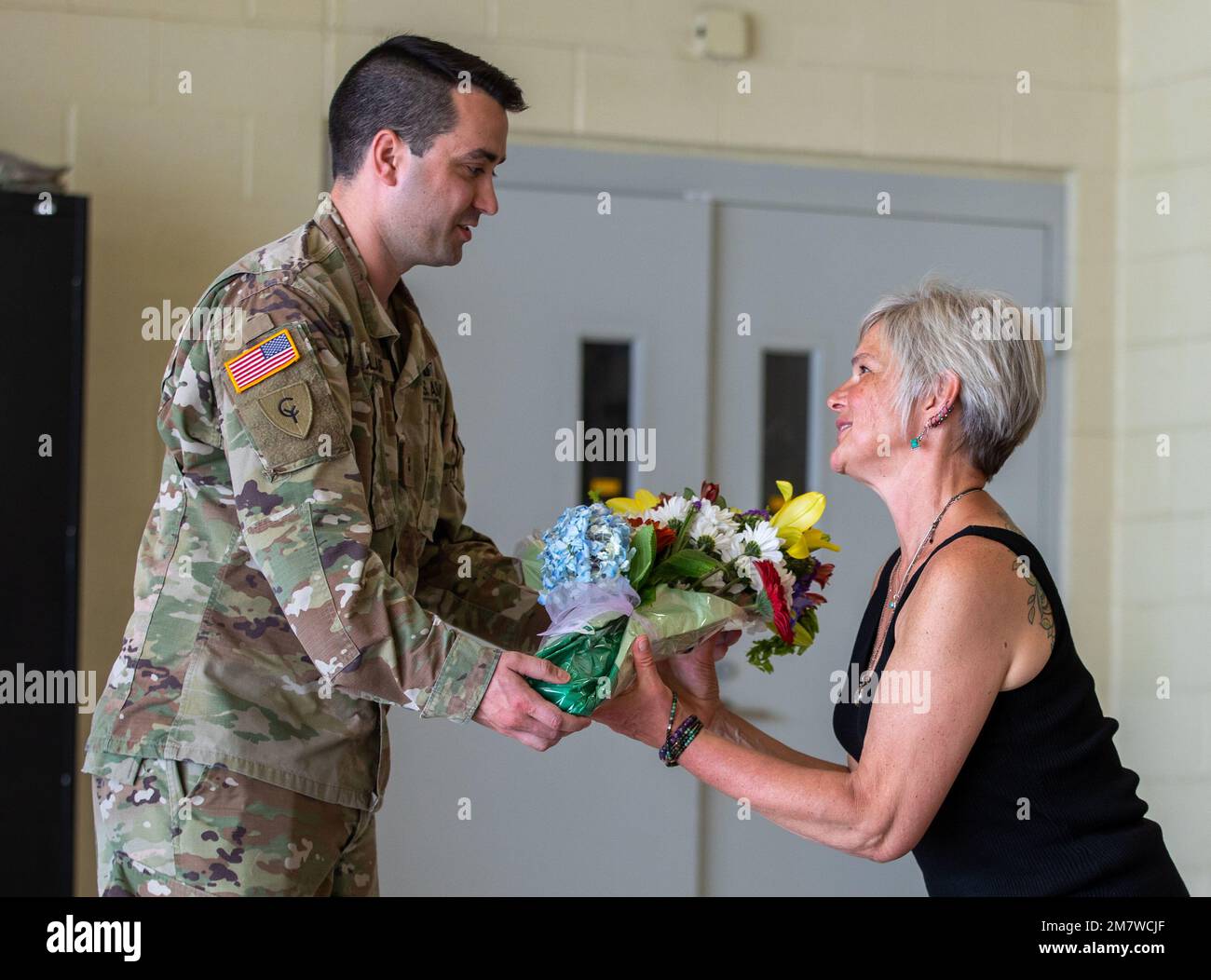 Sandy Jacques, wife of Chief Warrant Officer 5 Daniel Jacques, receives ...