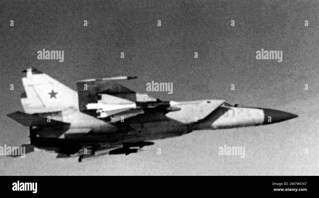 An air-to-air right side view of a Soviet MiG-25 Foxbat interceptor ...