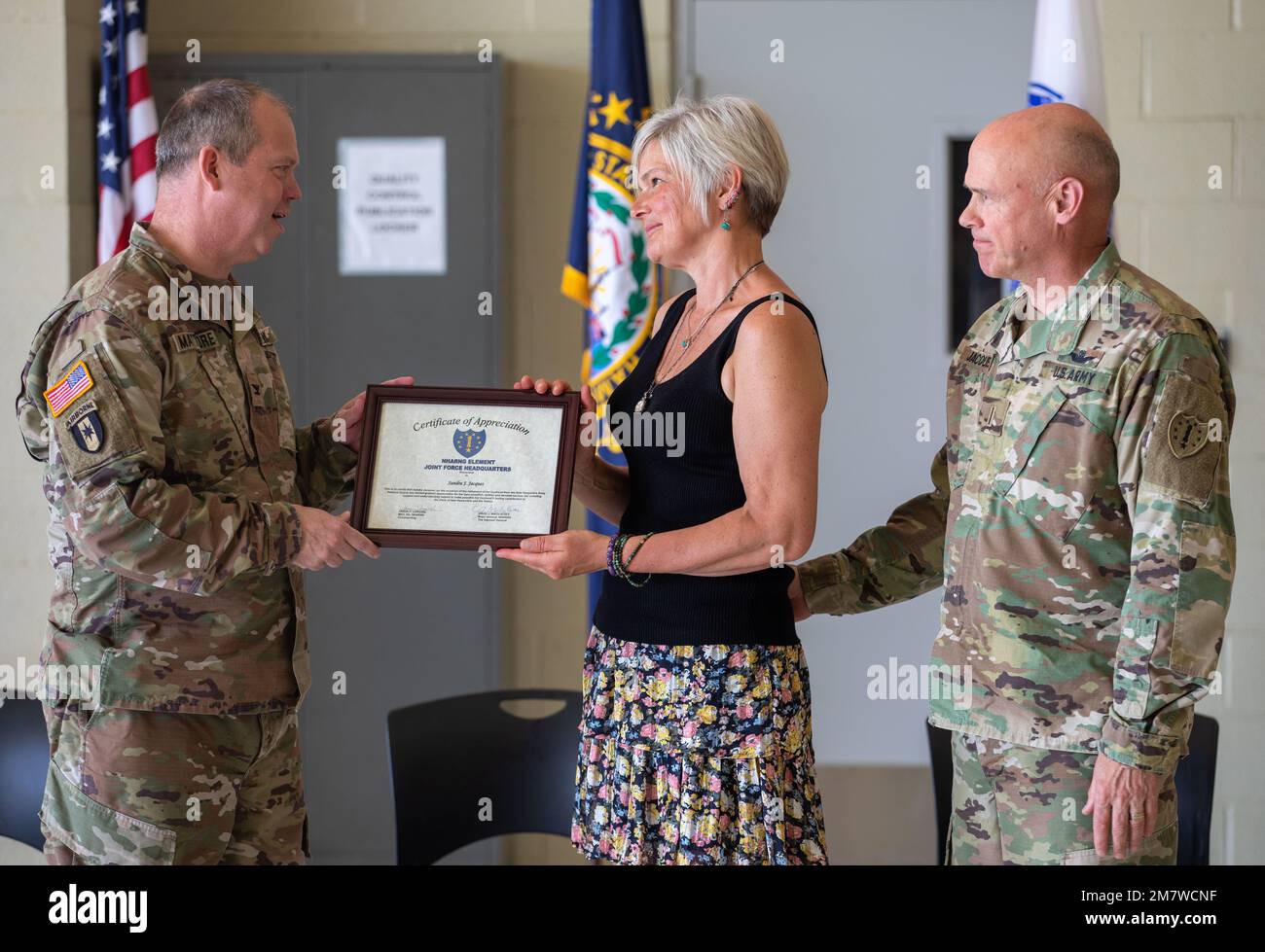 Sandy Jacques, wife of Chief Warrant Officer 5 Daniel Jacques, receives ...