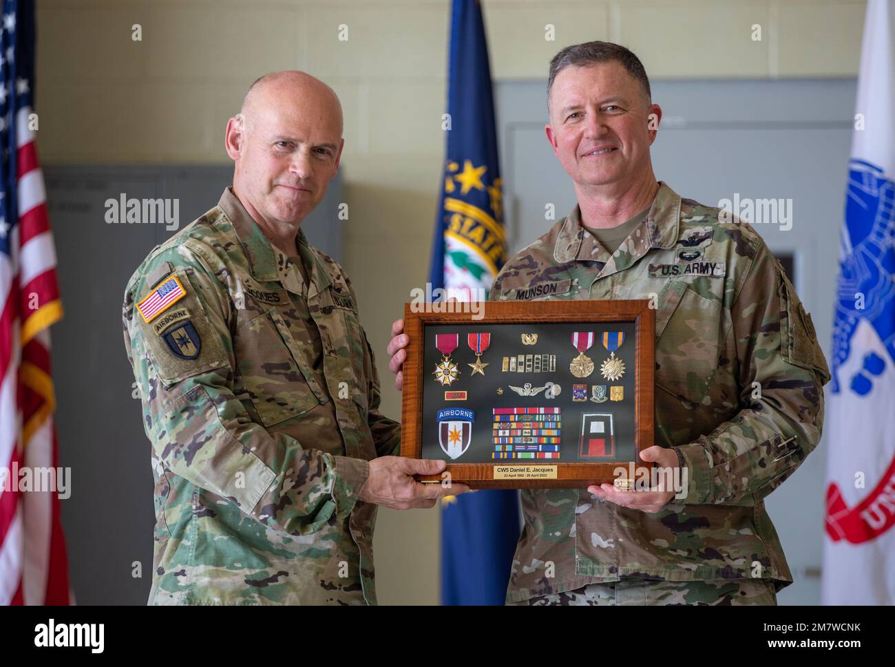(From left to right) Chief Warrant Officer 5 Daniel Jacques receives a shadow box from Chief ...
