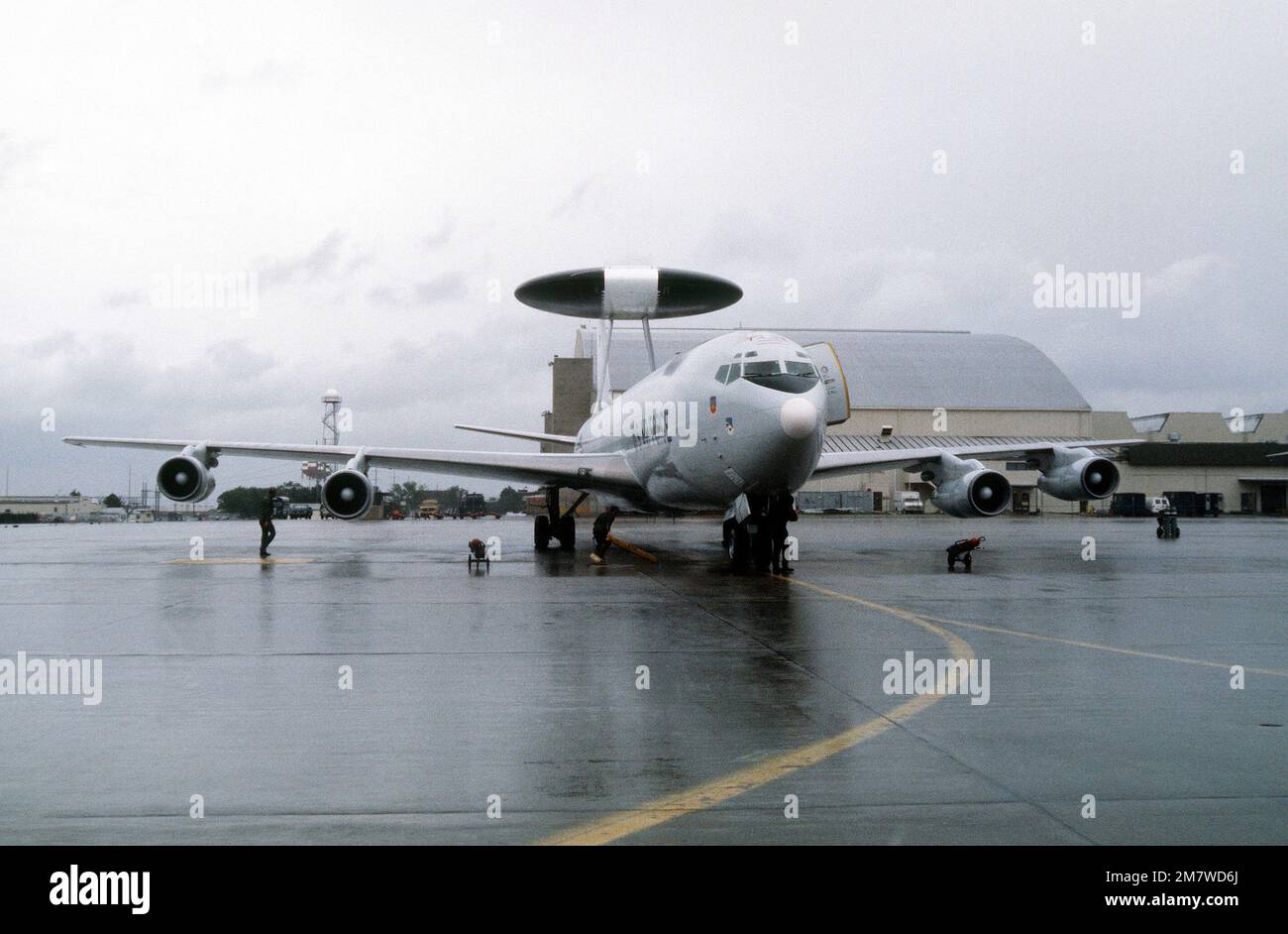 A right front view of an E-3A Sentry aircraft parked on the apron ...