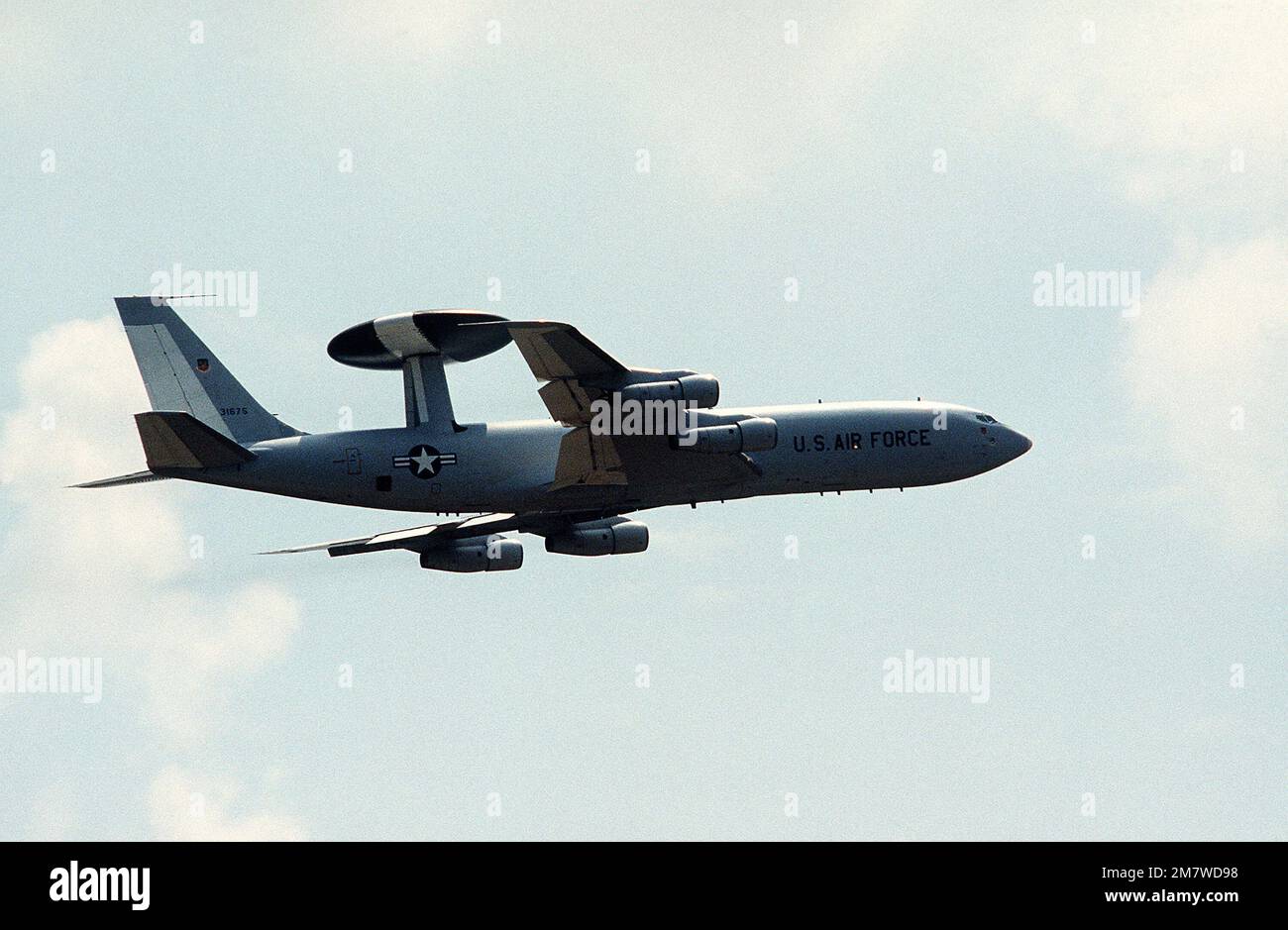 A right underside view of an E-3A Sentry aircraft in-flight during ...