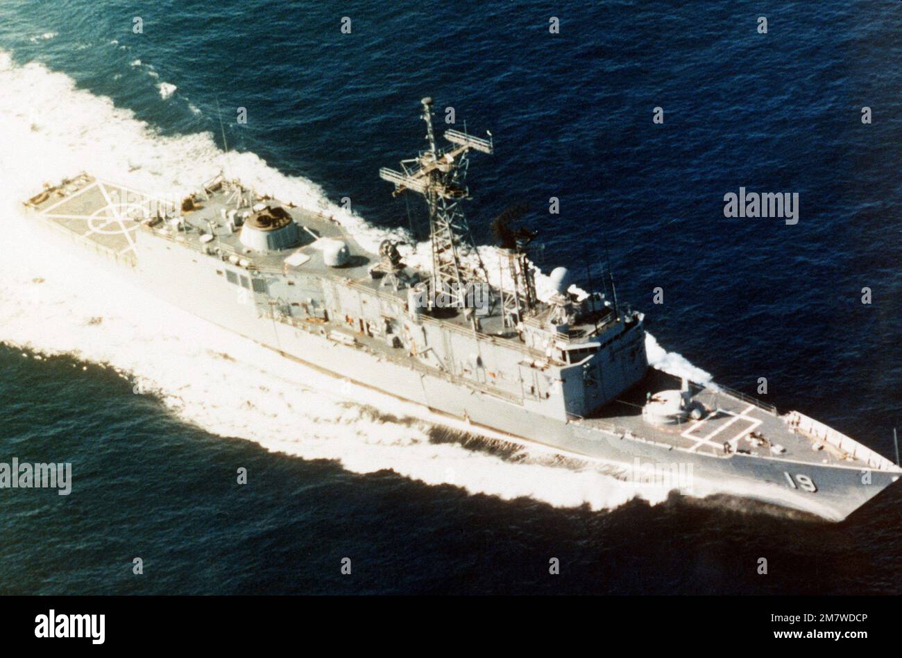 An aerial starboard bow view of the guided missile frigate USS JOHN A ...