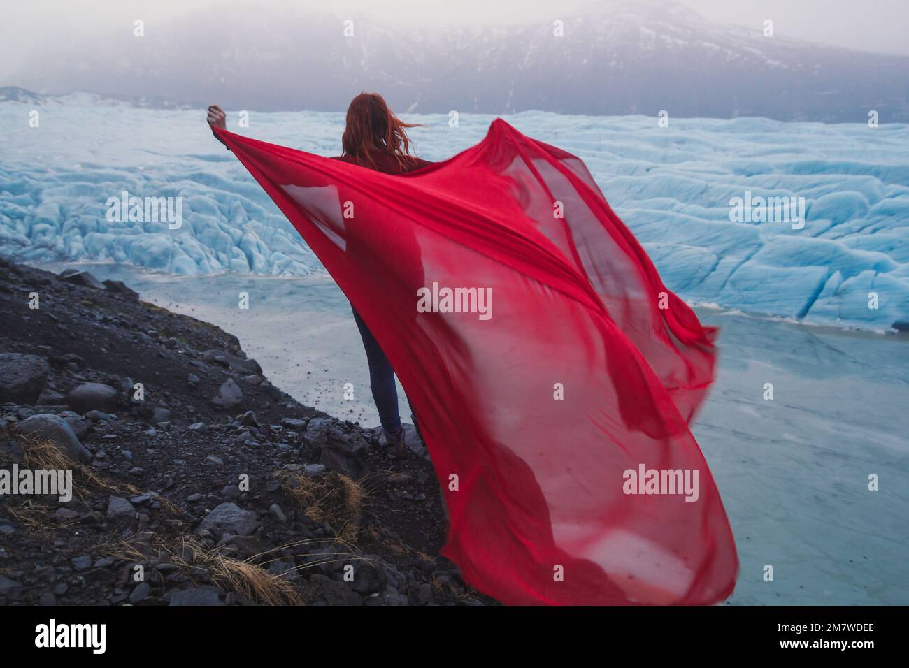 Person with sheet of waving chiffon scenic photography Stock Photo - Alamy