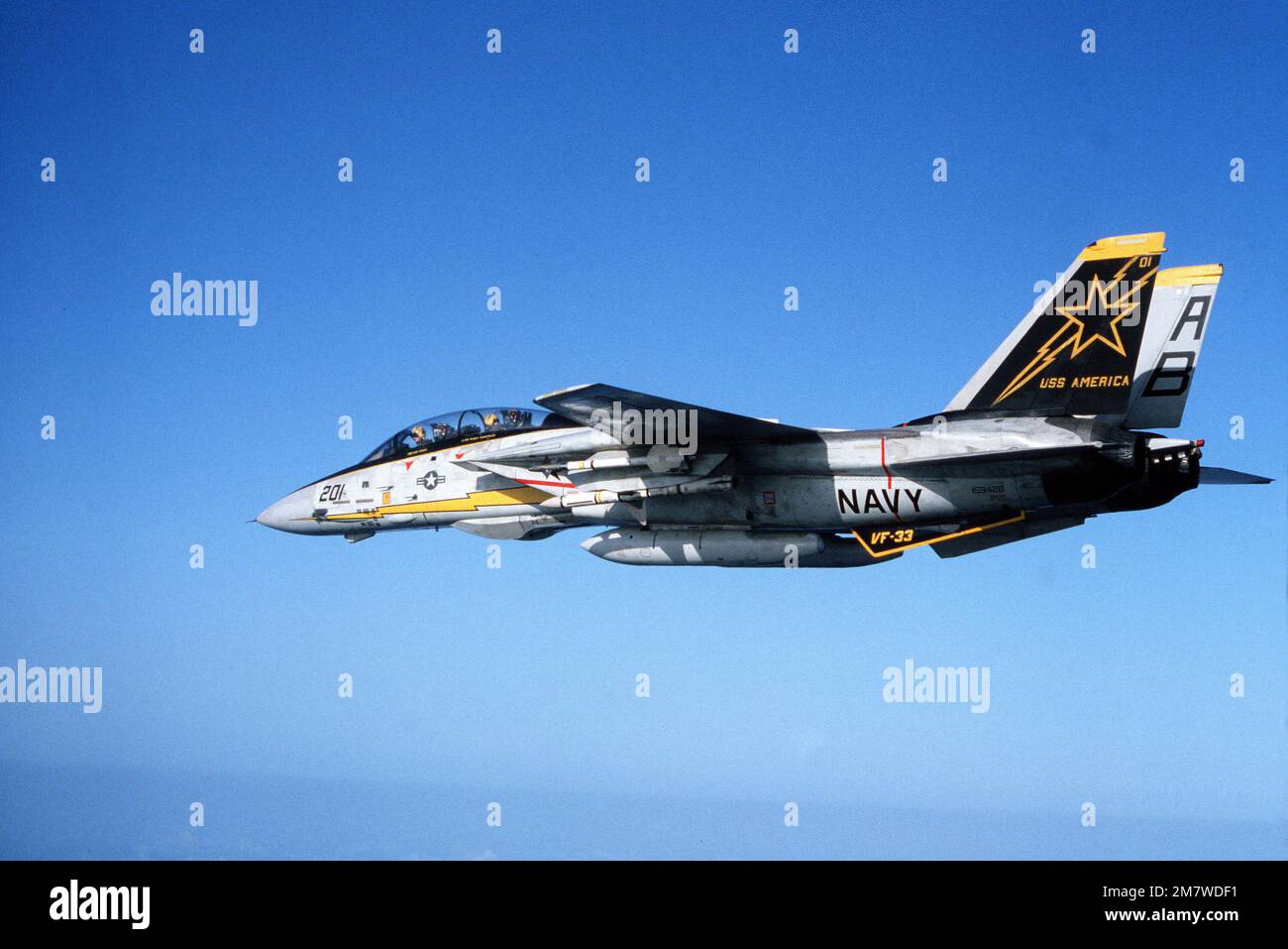 An air-to-air left side view of an F-14 Tomcat aircraft assigned to the ...