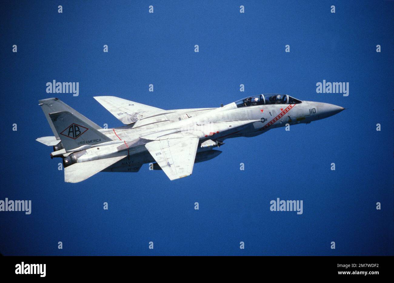 An air-to-air right side view of an F-14 Tomcat aircraft assigned to ...