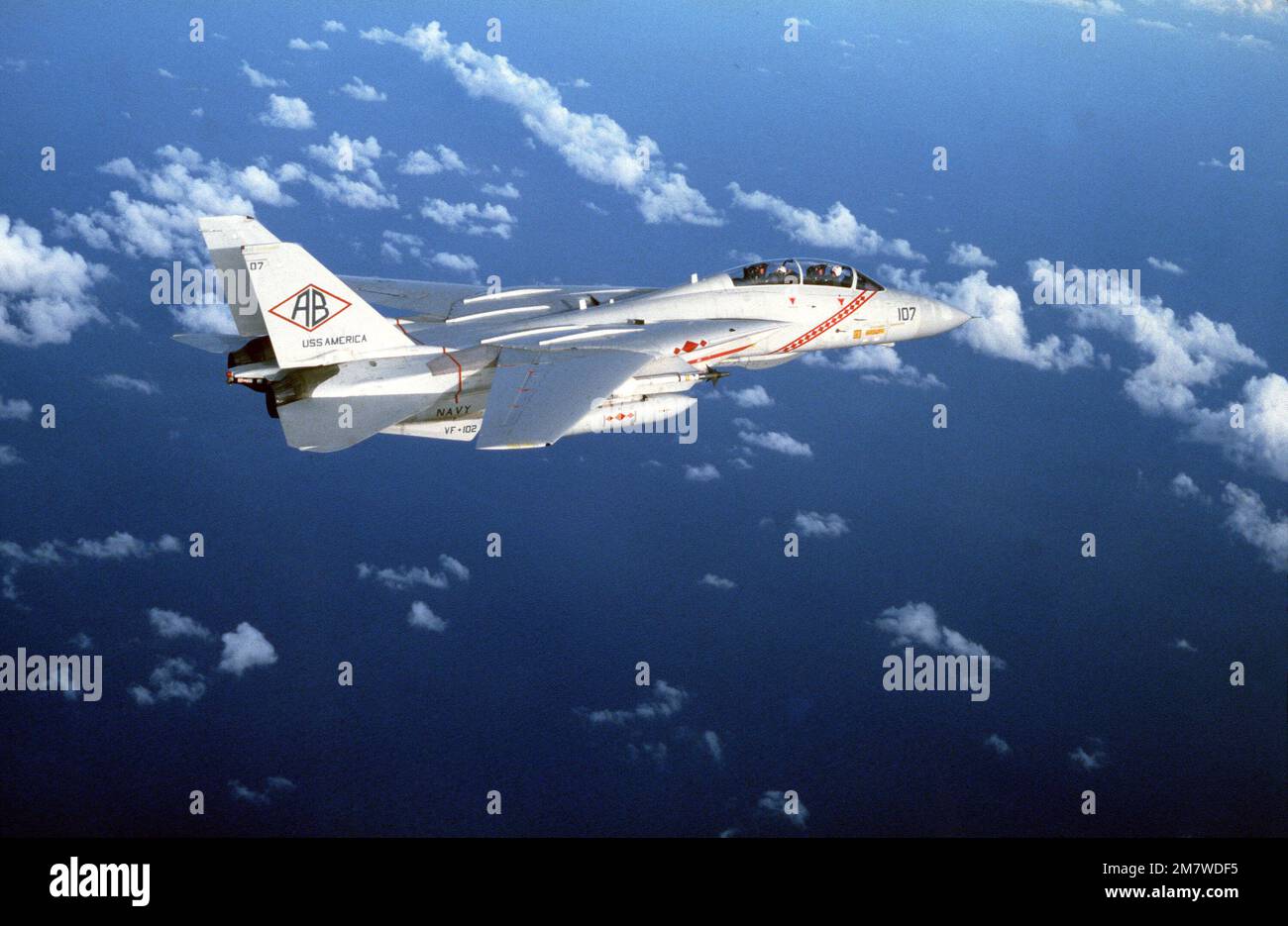 An air-to-air right side view of an F-14 Tomcat aircraft assigned to ...