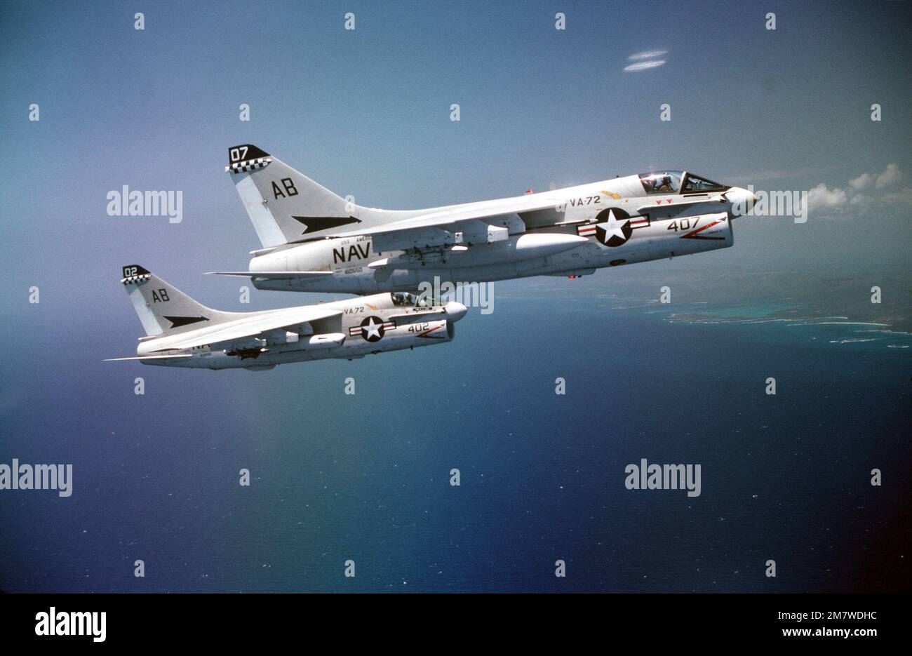 An air-to-air right side view of two A-7 Corsair aircraft assigned to ...