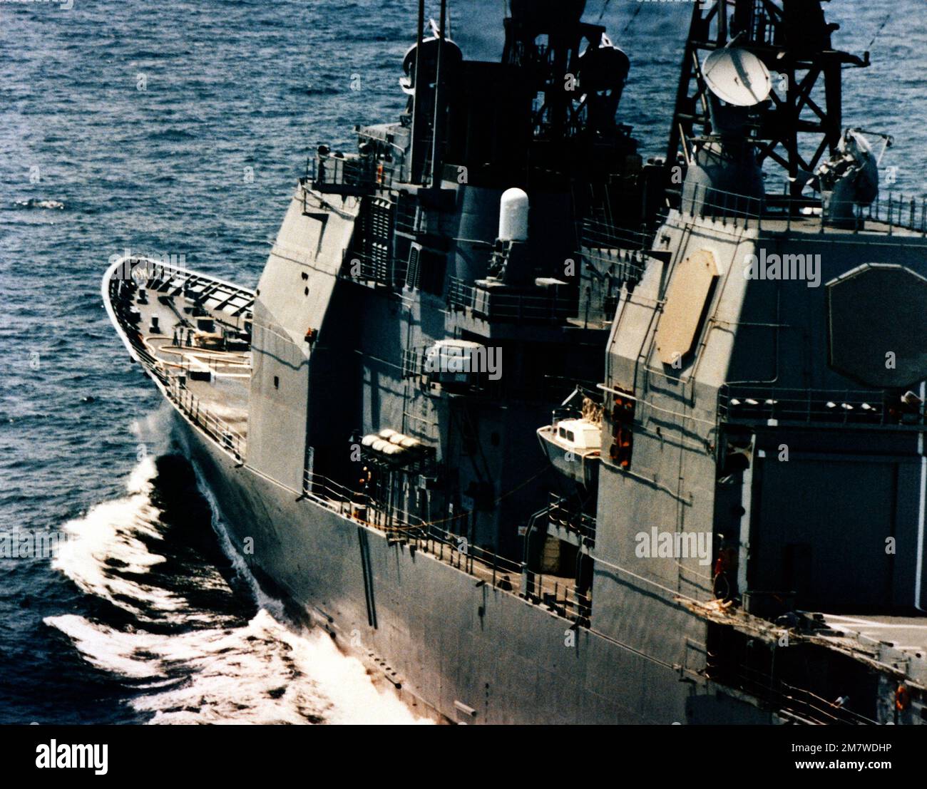 A port quarter view of the Aegis guided missile cruiser USS TICONDEROGA ...