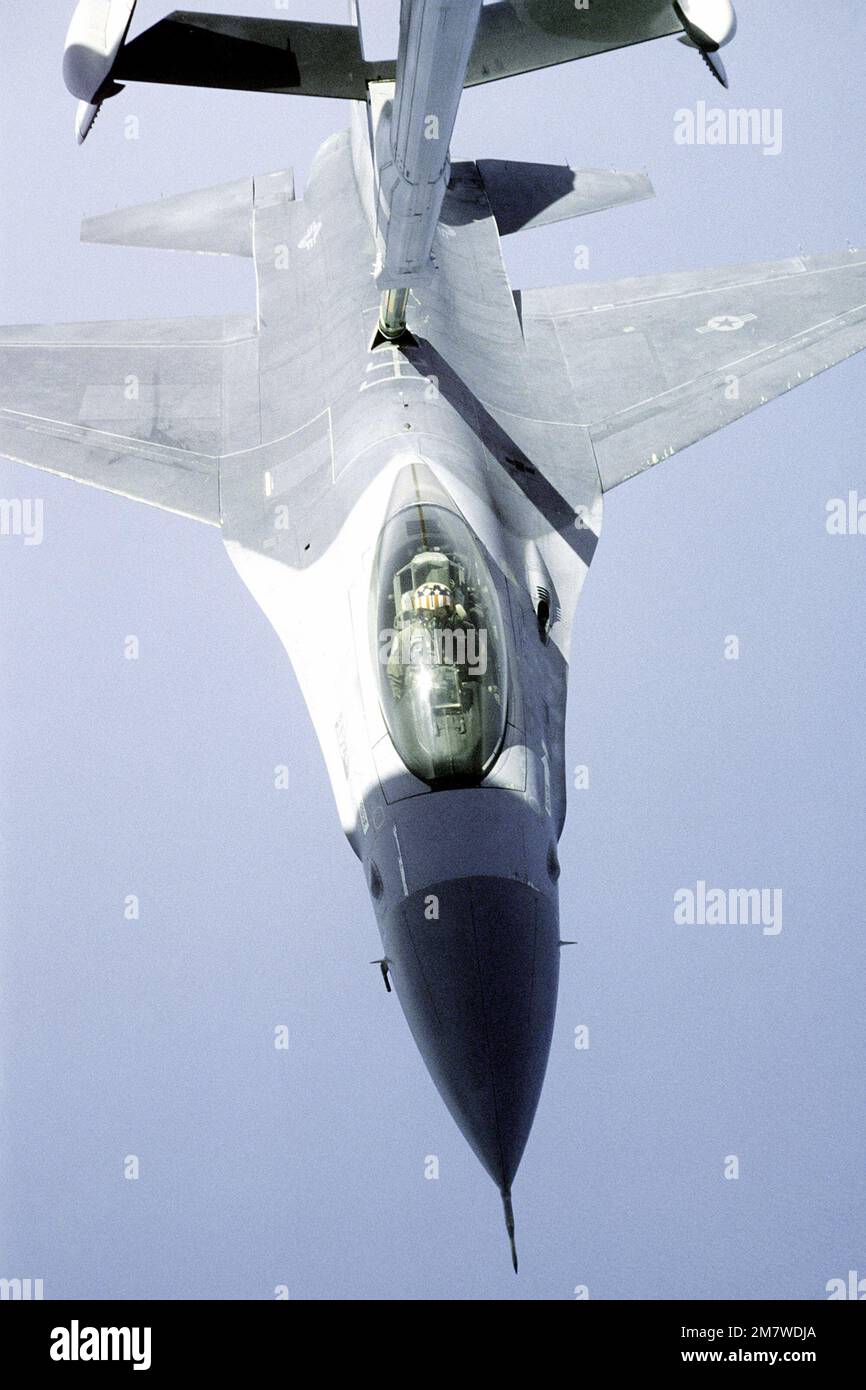 Top front view of an F-16 Fighting Falcon aircraft being refueled by a ...