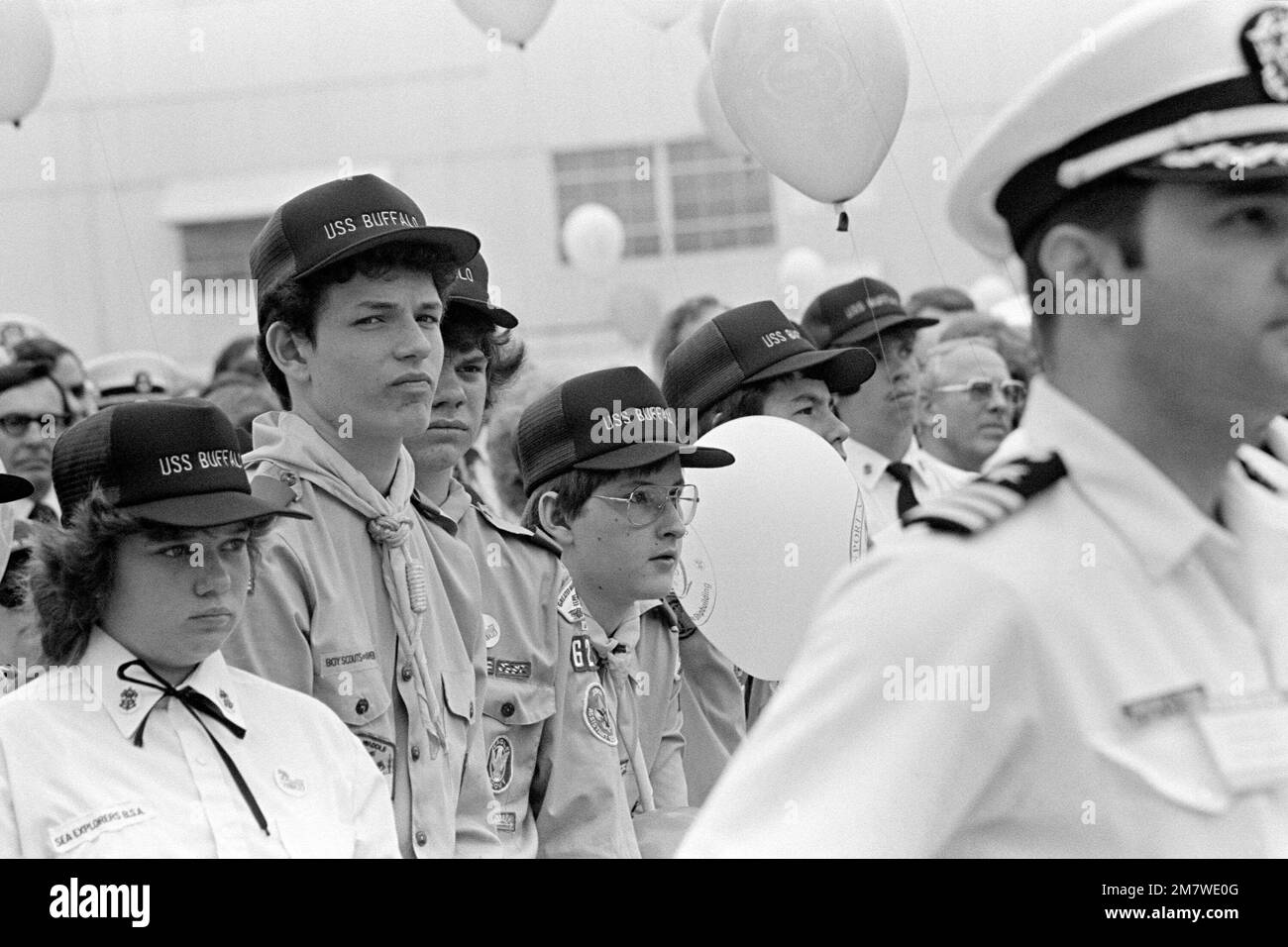 A boy scout troop, wearing ship's caps, attend the launching ceremony ...