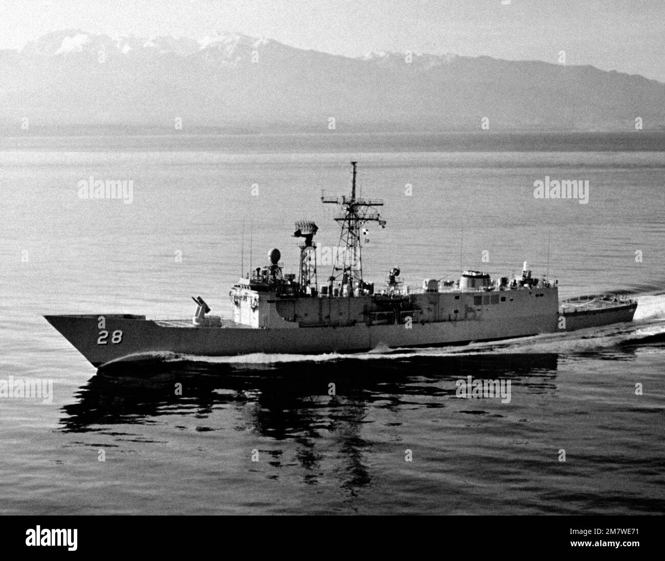 An aerial port bow view of the guided missile frigate USS BOONE (FFG 28 ...