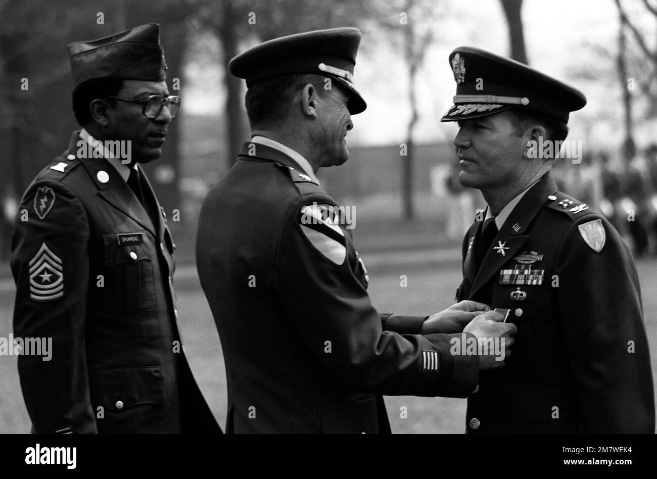 Brigade General George R. Stotser presents the Legion of Merit medal to ...