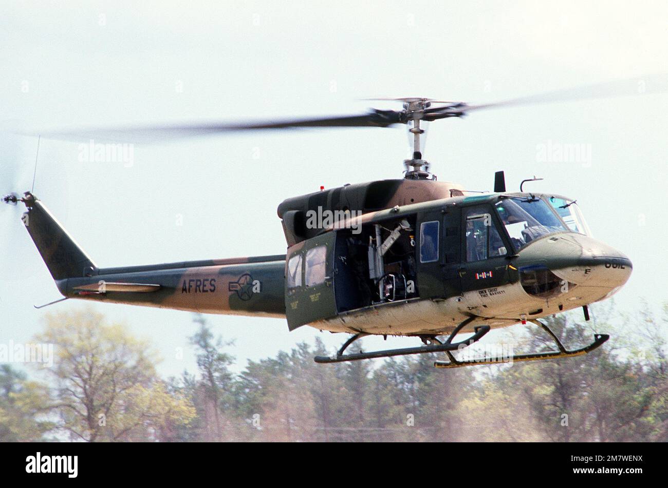 Right side view of a UH-1H Huey helicopter, taking off on maneuvers ...